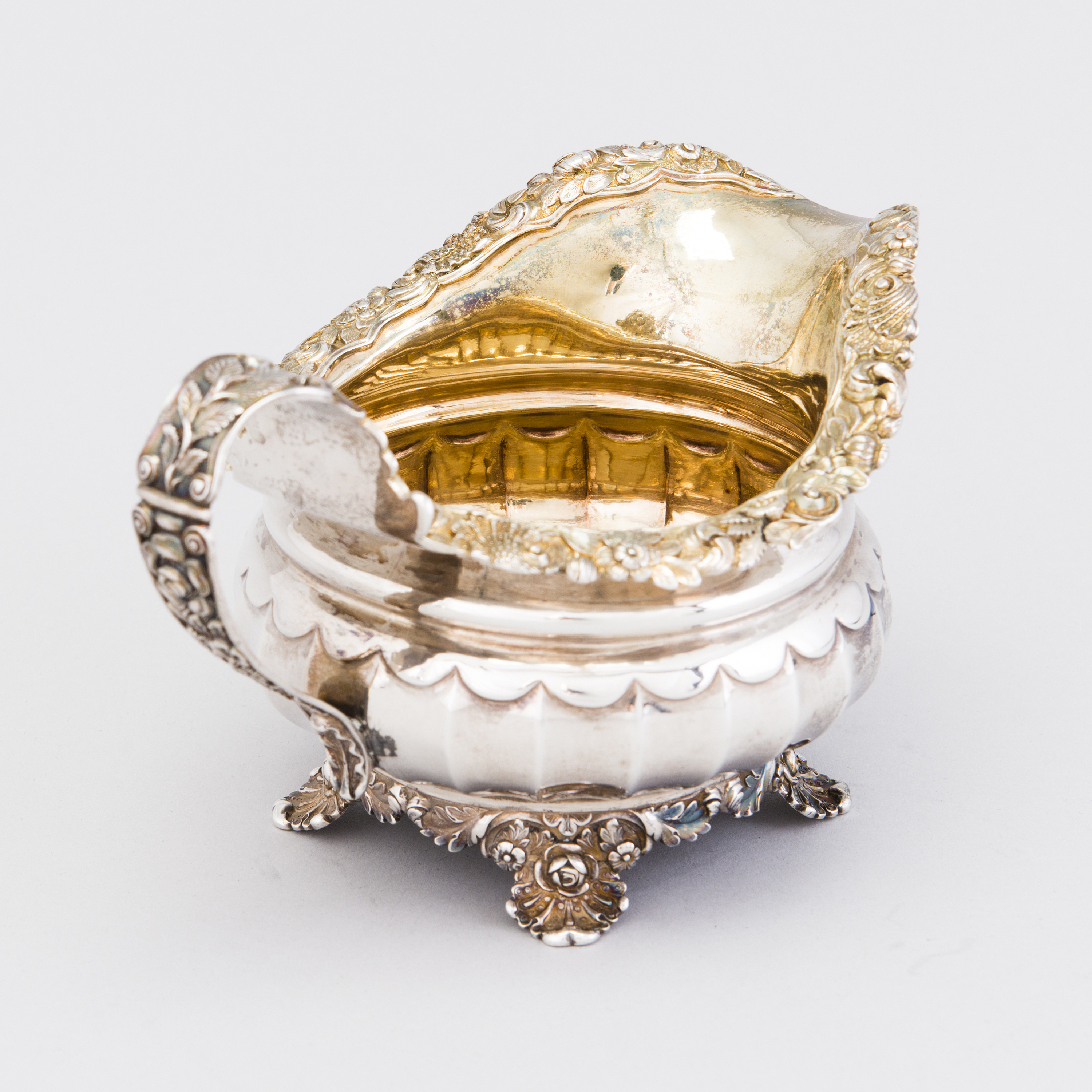 REBECCA EMES & EDWARD BARNARD I, A parcel-gilt milk jug, London 1822 ...