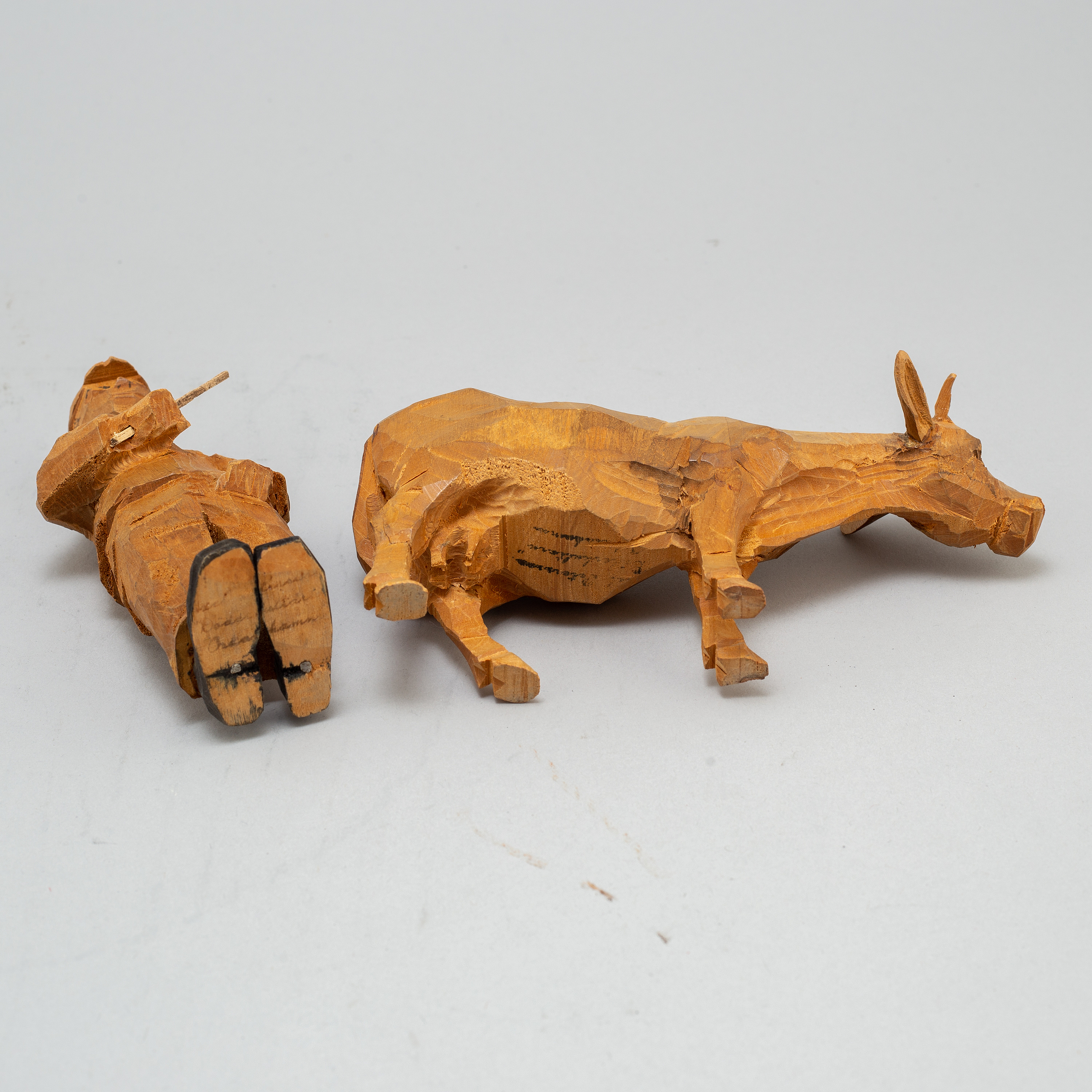 AXEL PETERSSON DÖDERHULTARN, two carved wooden sculptures, signed ...