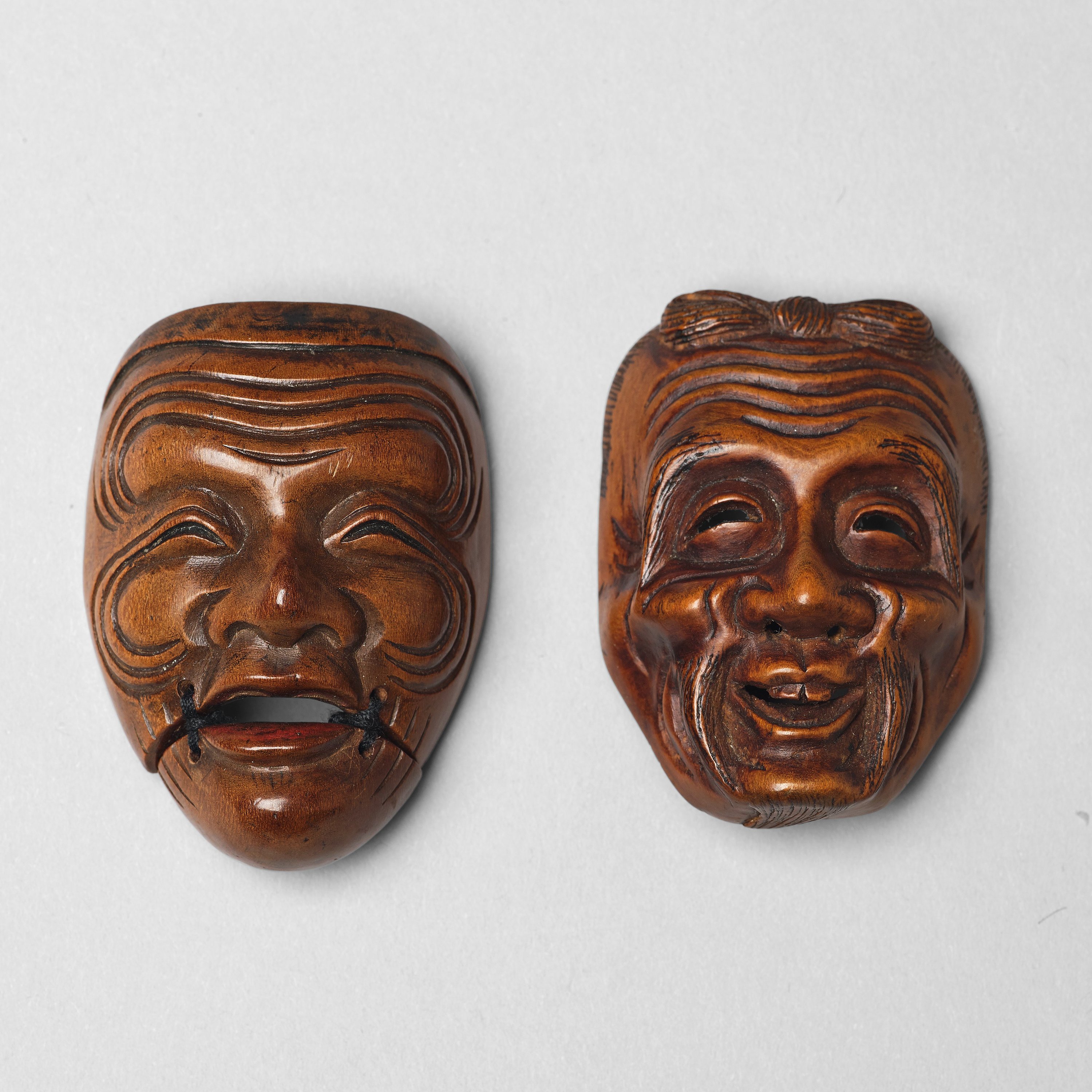 Two Japanese Netsuke masks, Meiji period (1868-1912). - Bukowskis