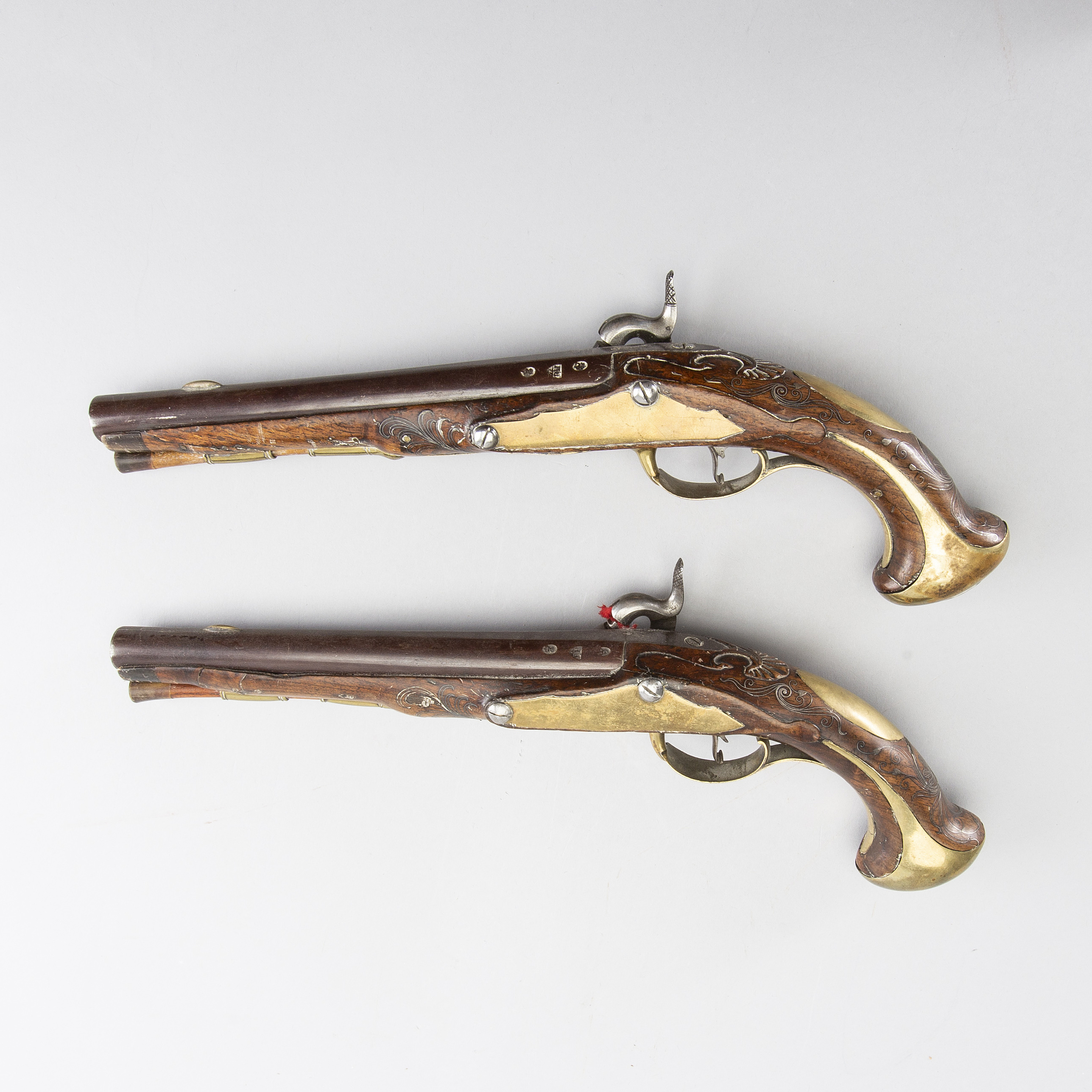 A pair of cap lock pistols marked Collumbell, 18th century. - Bukowskis