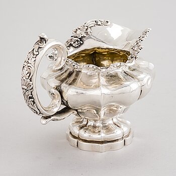 GUSTAV MAGNUS OKERBLOM, A silver cream jug, assay master Dimitry ...