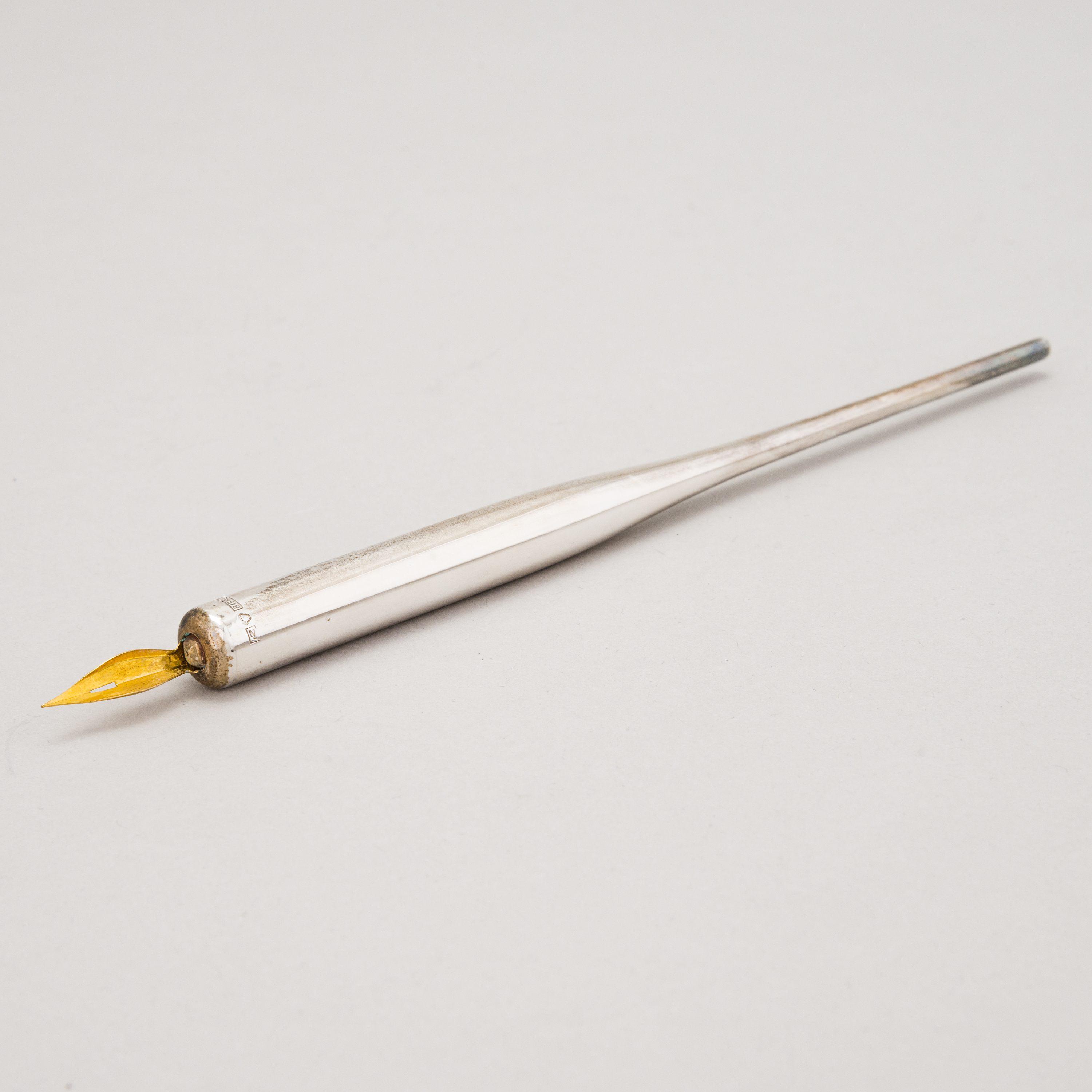 Four silver writing desk utensils and two pair of silver candlesticks ...