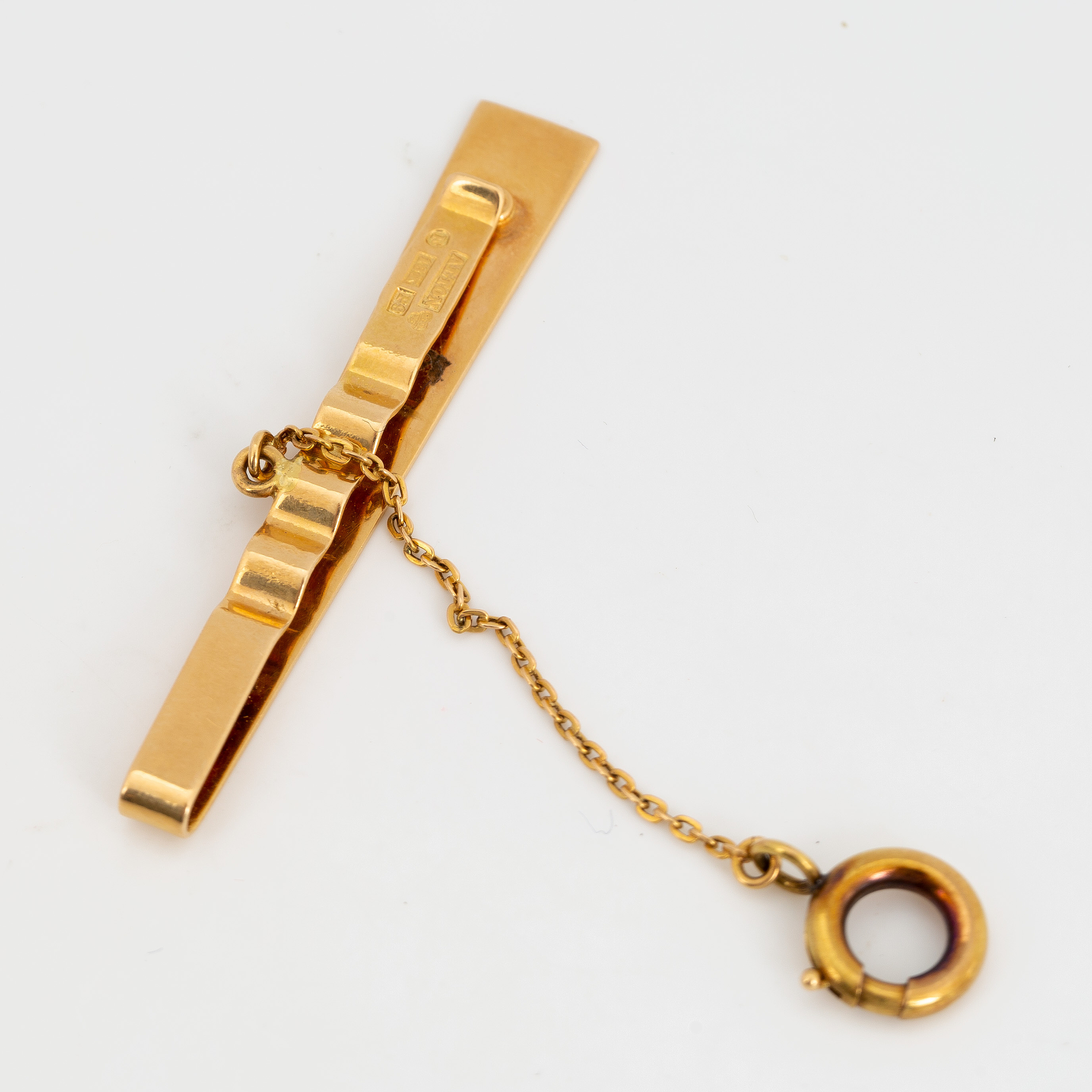 18K gold cufflinks and tie clip. - Bukowskis