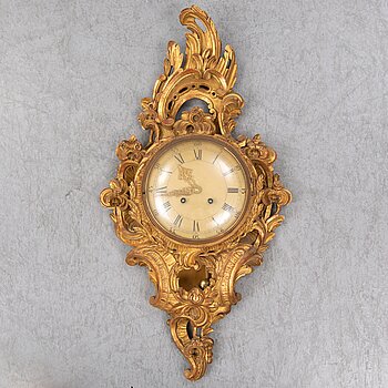 A mid 20th century rococo style wall clock. - Bukowskis