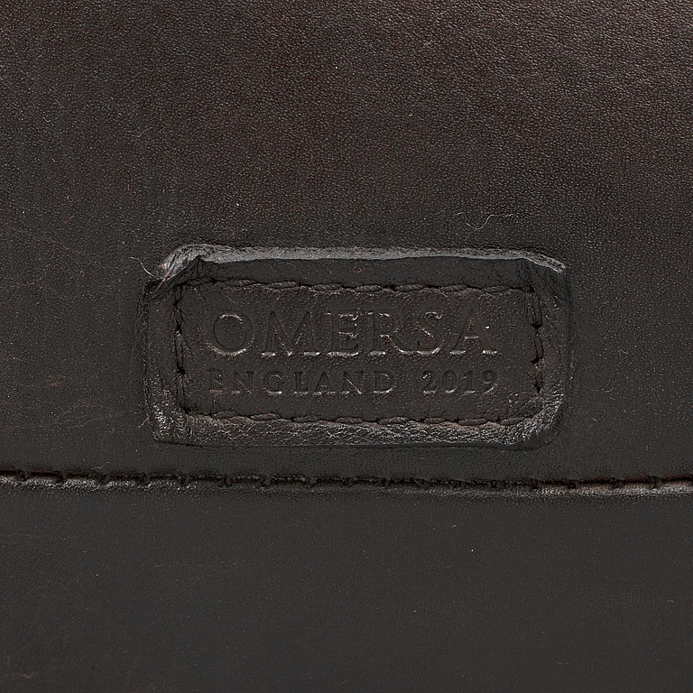A leather footstool by Dimitri Omersa & Co. - Bukowskis