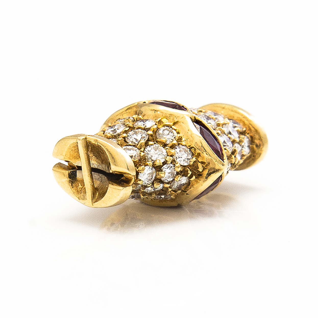 An 18K gold lock with diamonds ca 1.40 ct in total and rubies. Marked ...