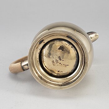 An English 20th century Britannia silver-gilt milk-jug, marked LAC ...