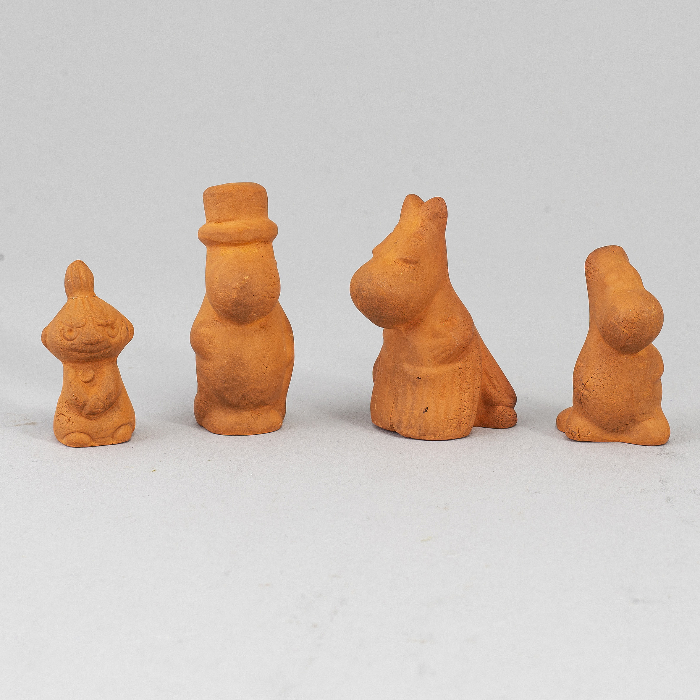 SIGNE HAMMARSTEN-JANSSON a set of four earthenware moomin figurines ...