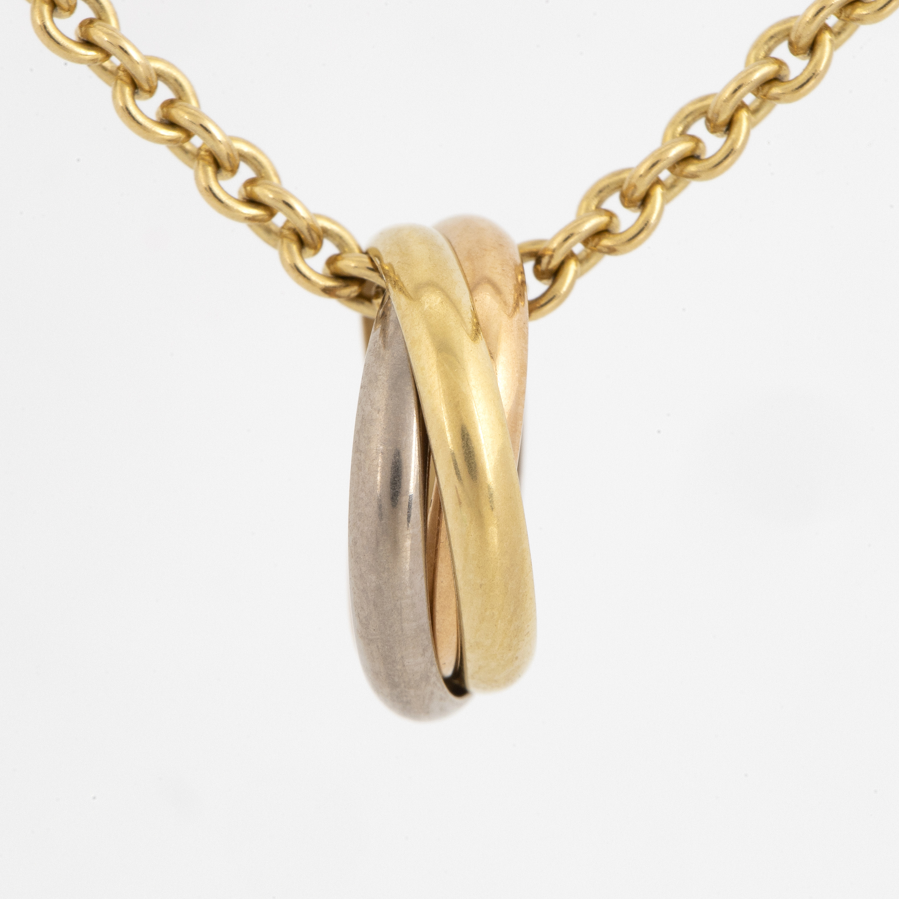 CARTIER collier 18K guld "Trinity". - Bukowskis