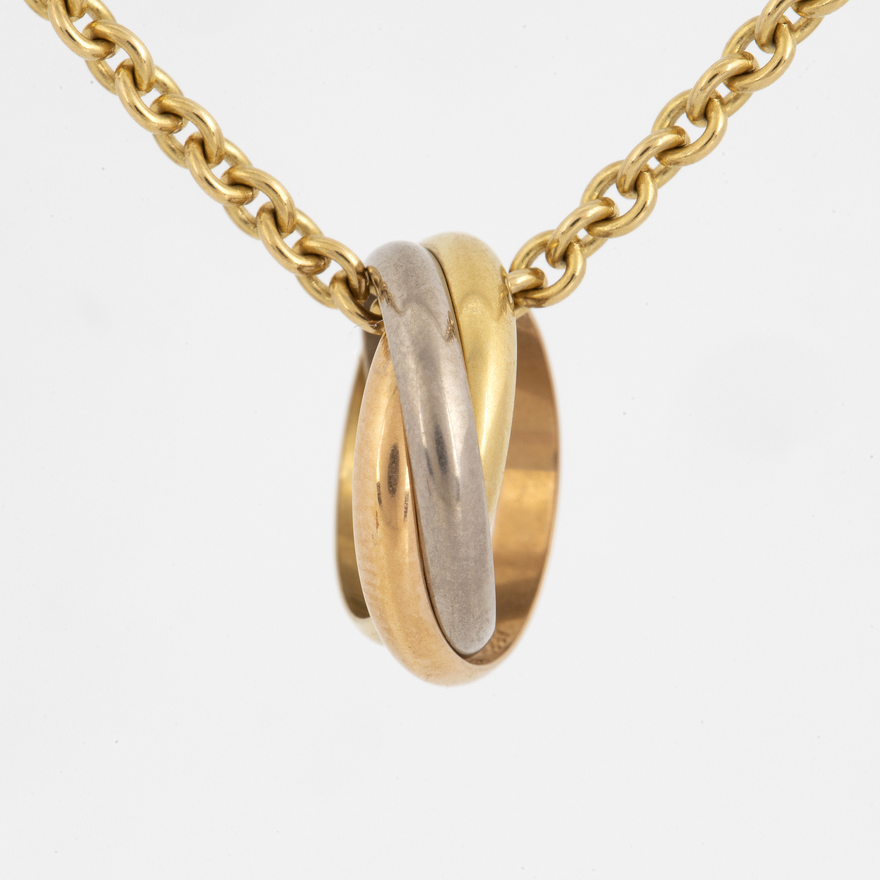 CARTIER collier 18K guld "Trinity". - Bukowskis