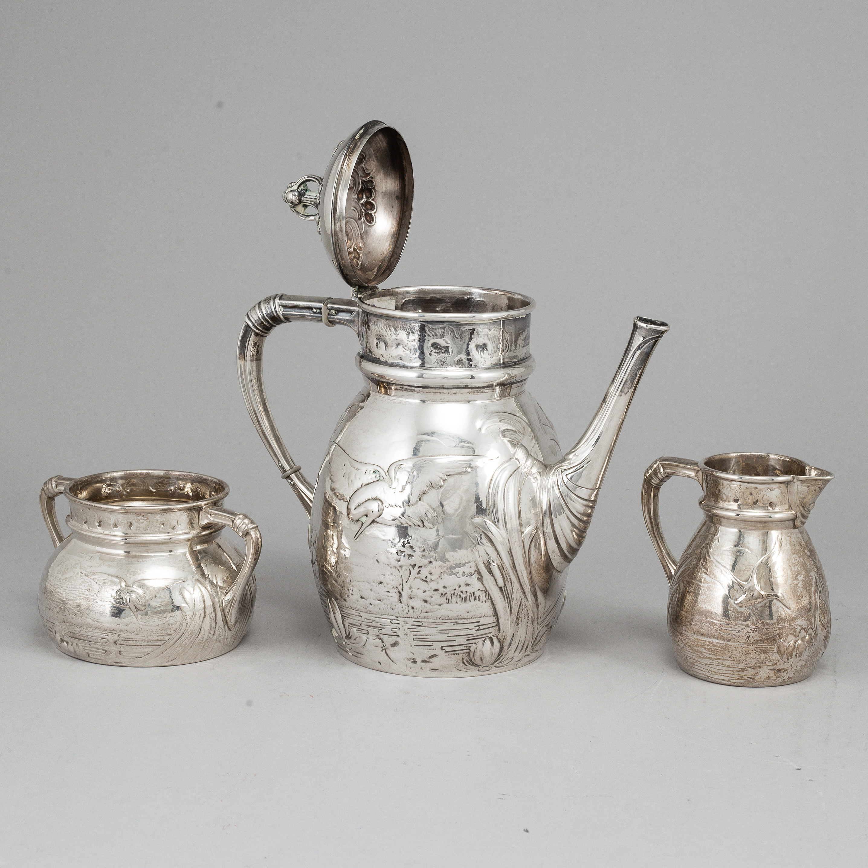 A silver coffee pot, creamer and sugar bowl, marked Emil Oscar Möller ...