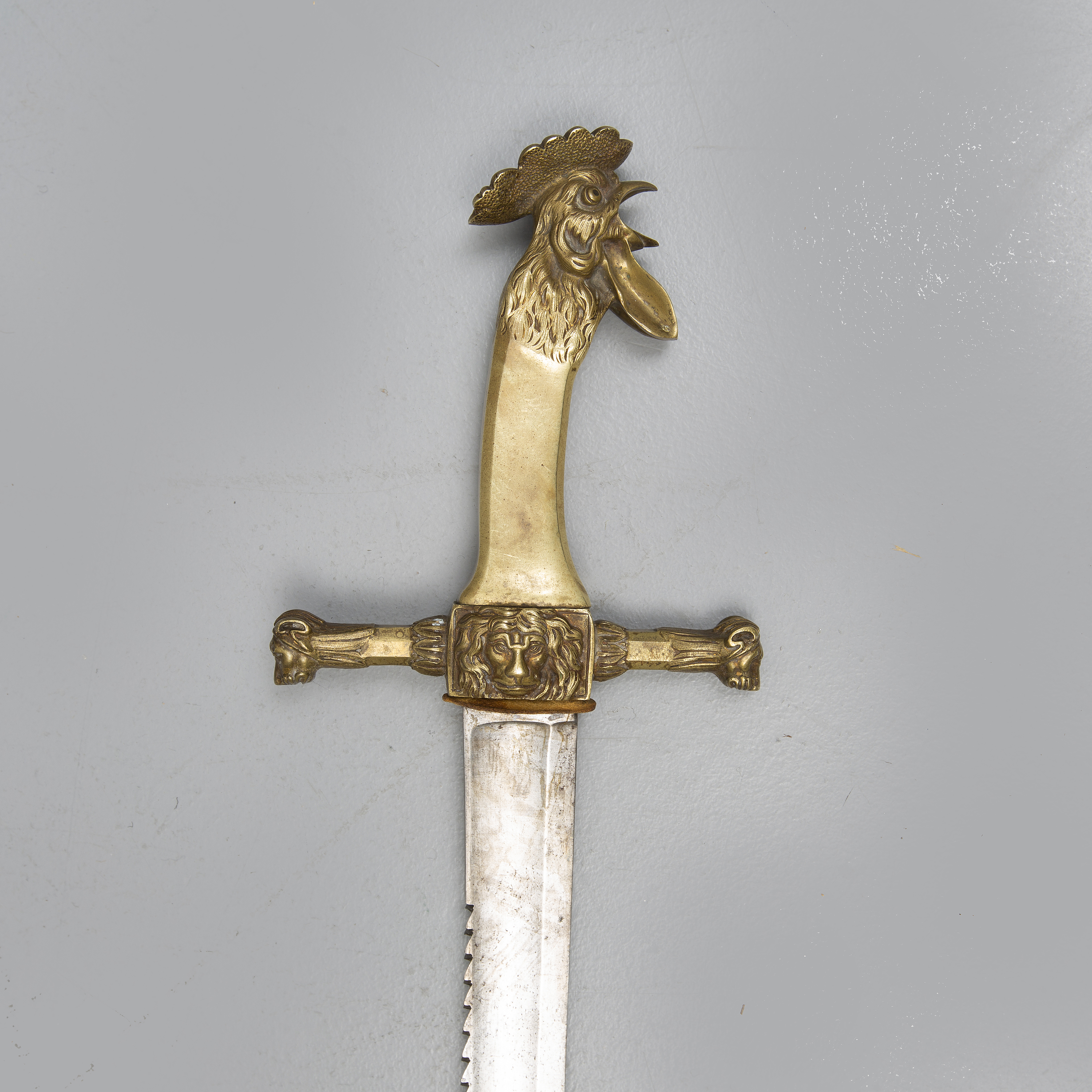 An early 19th Century Napoleonic rooster head sword. Curved blade with ...