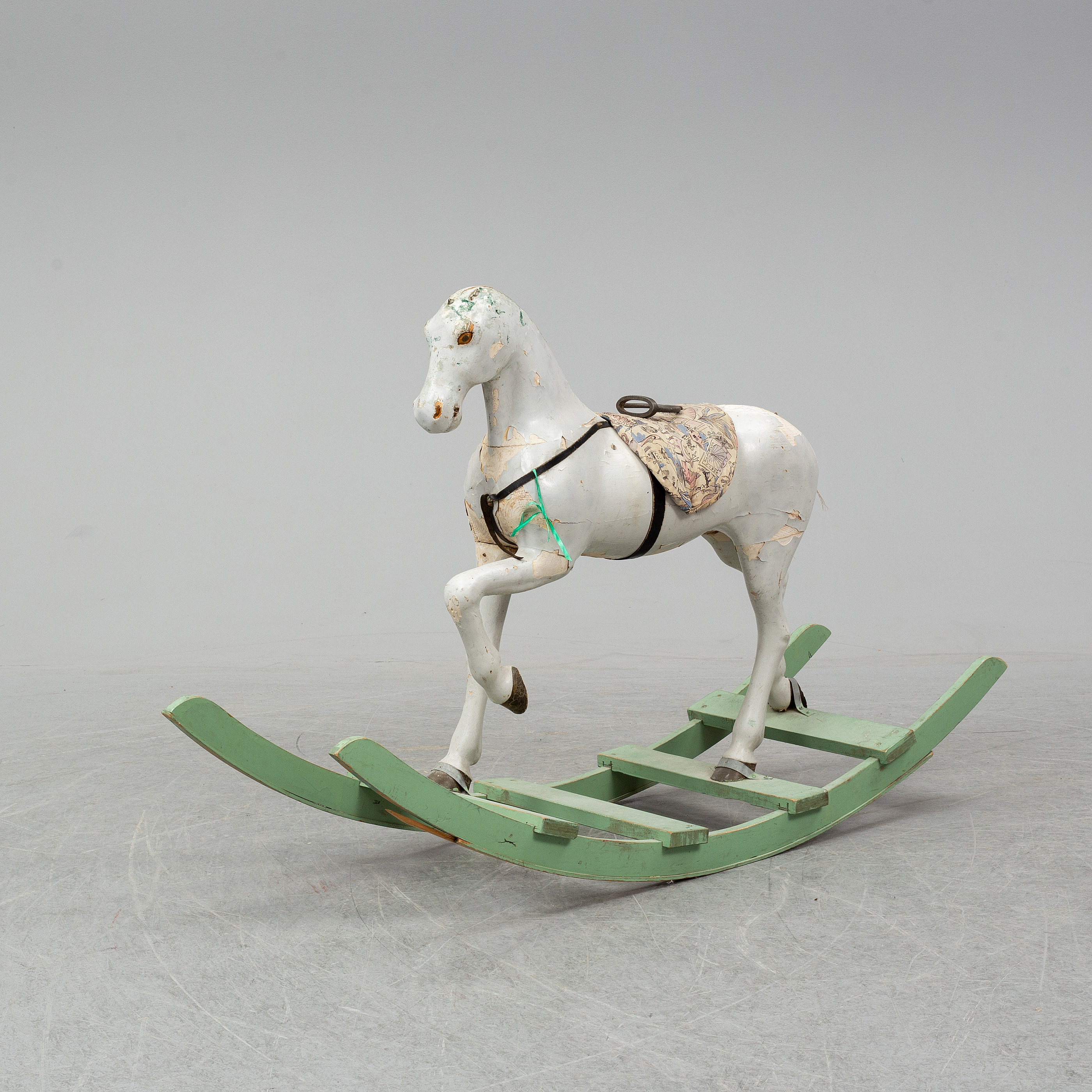 A wooden rocking horse from the early 20th century. - Bukowskis