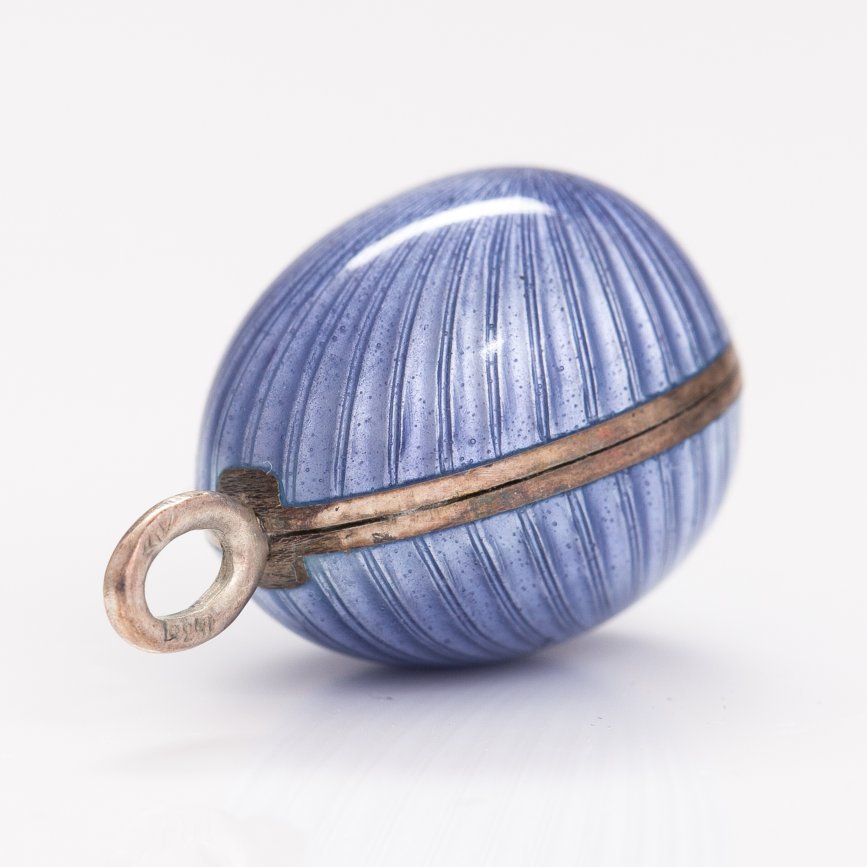 A TILLLANDER, A silver and enamel pendant in the form of an egg ...