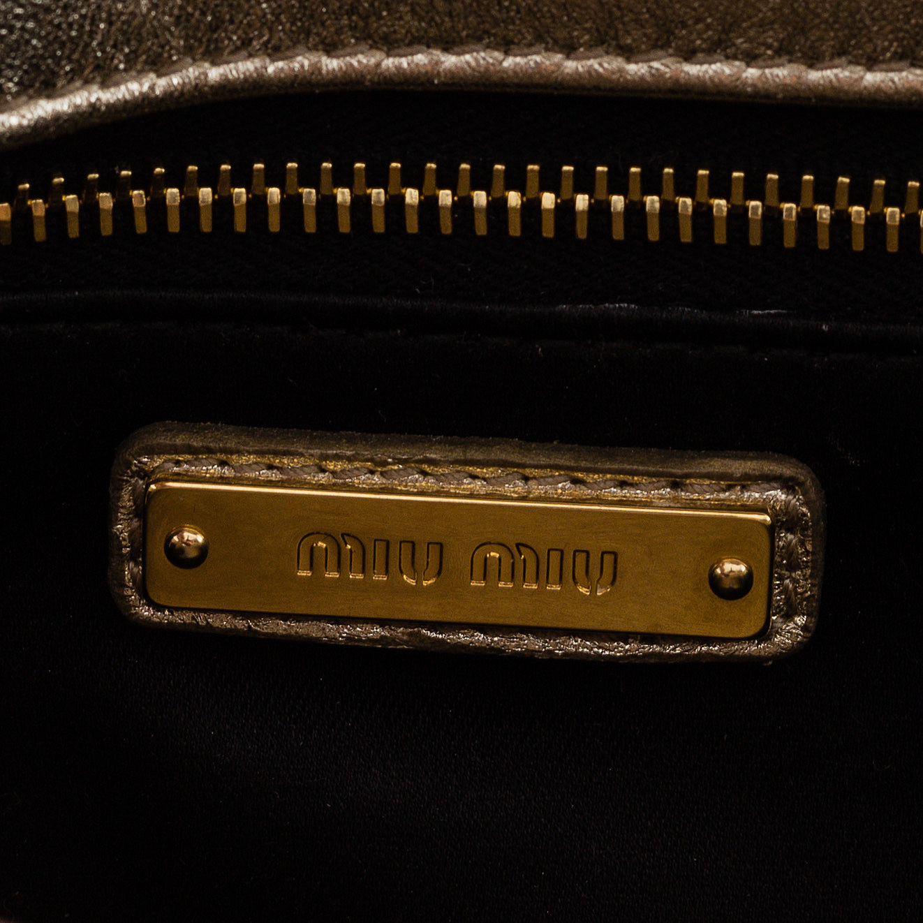 MUI MUI, a gold leather bag and wallet. - Bukowskis