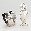 A sterling silver teapot and sugar caster, England 1900 and 1924 ...