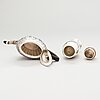 A sterling silver teapot and sugar caster, England 1900 and 1924 ...