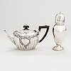 A sterling silver teapot and sugar caster, England 1900 and 1924 ...