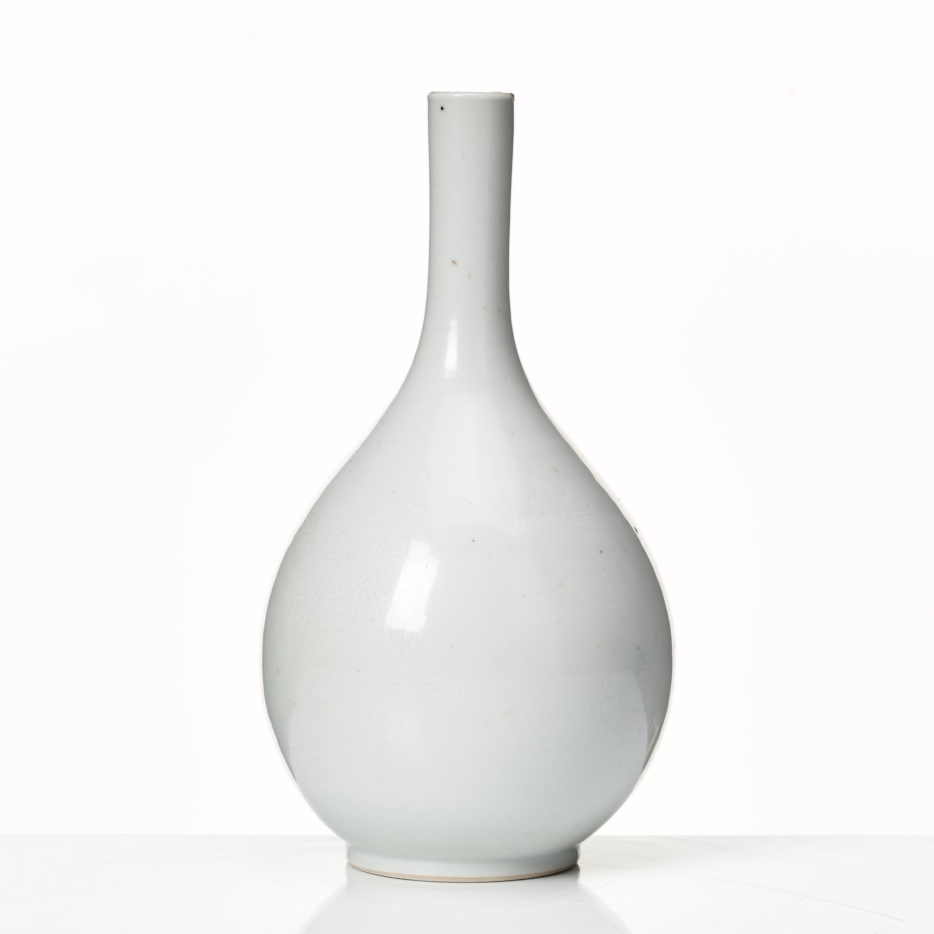 A white glazed anhua decorated vase, 18th Century, with Yongzheng four ...
