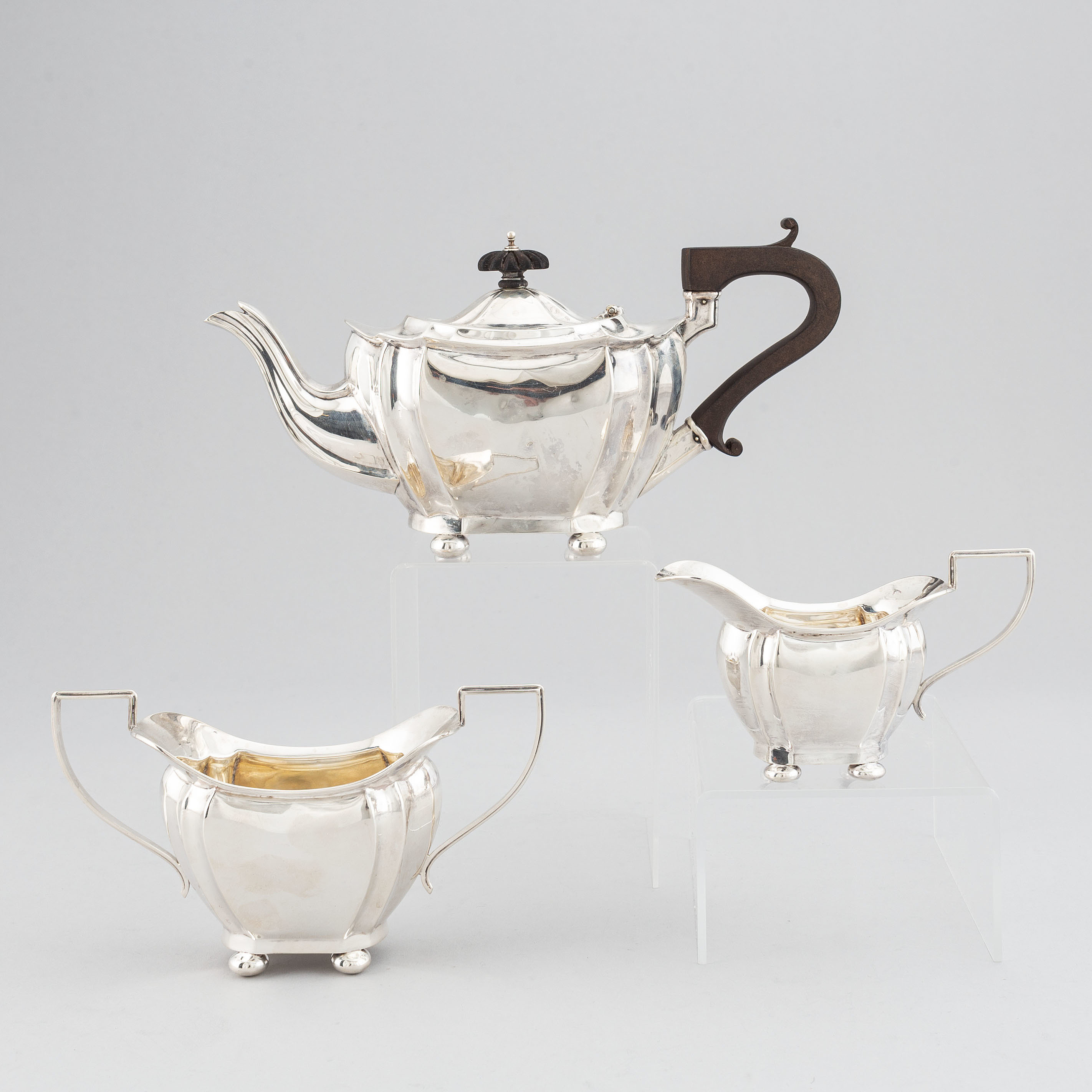 Joseph Gloster Ltd, a silver teapot, creamer and sugar bowl, Birmingham ...
