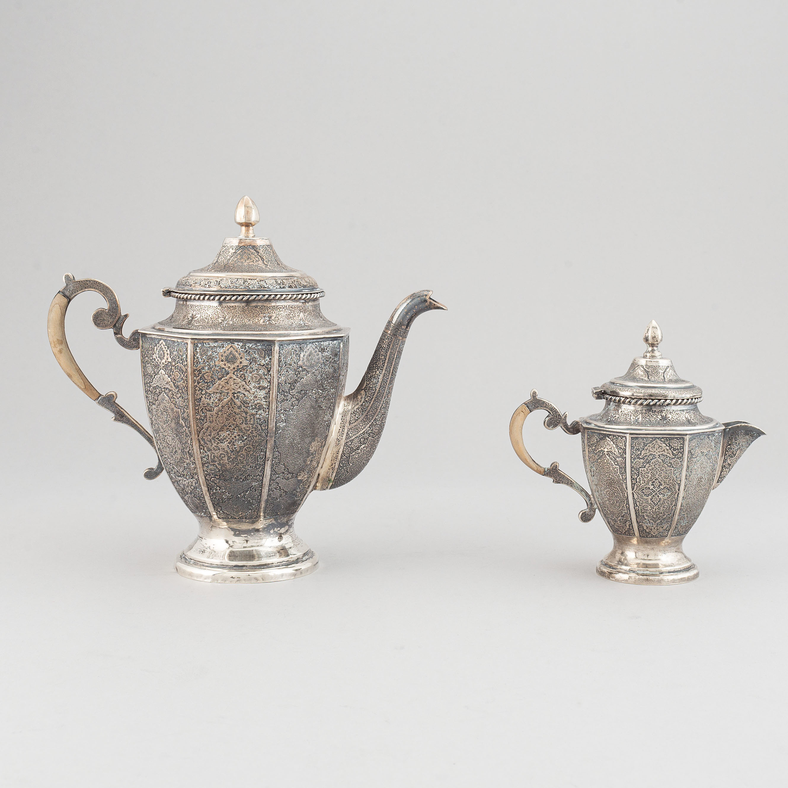 A persian silver coffee-pot and creamer, Iran Isfahan, late Pahlavi ...