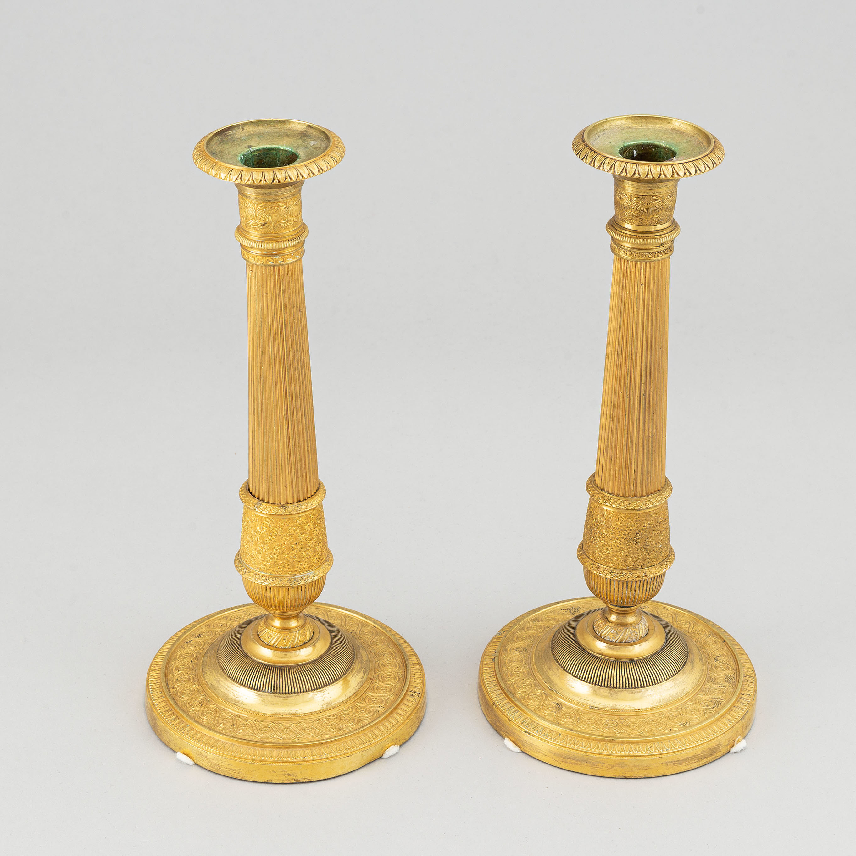 A pair of French bronze Empire candlesticks, early 19th Century ...