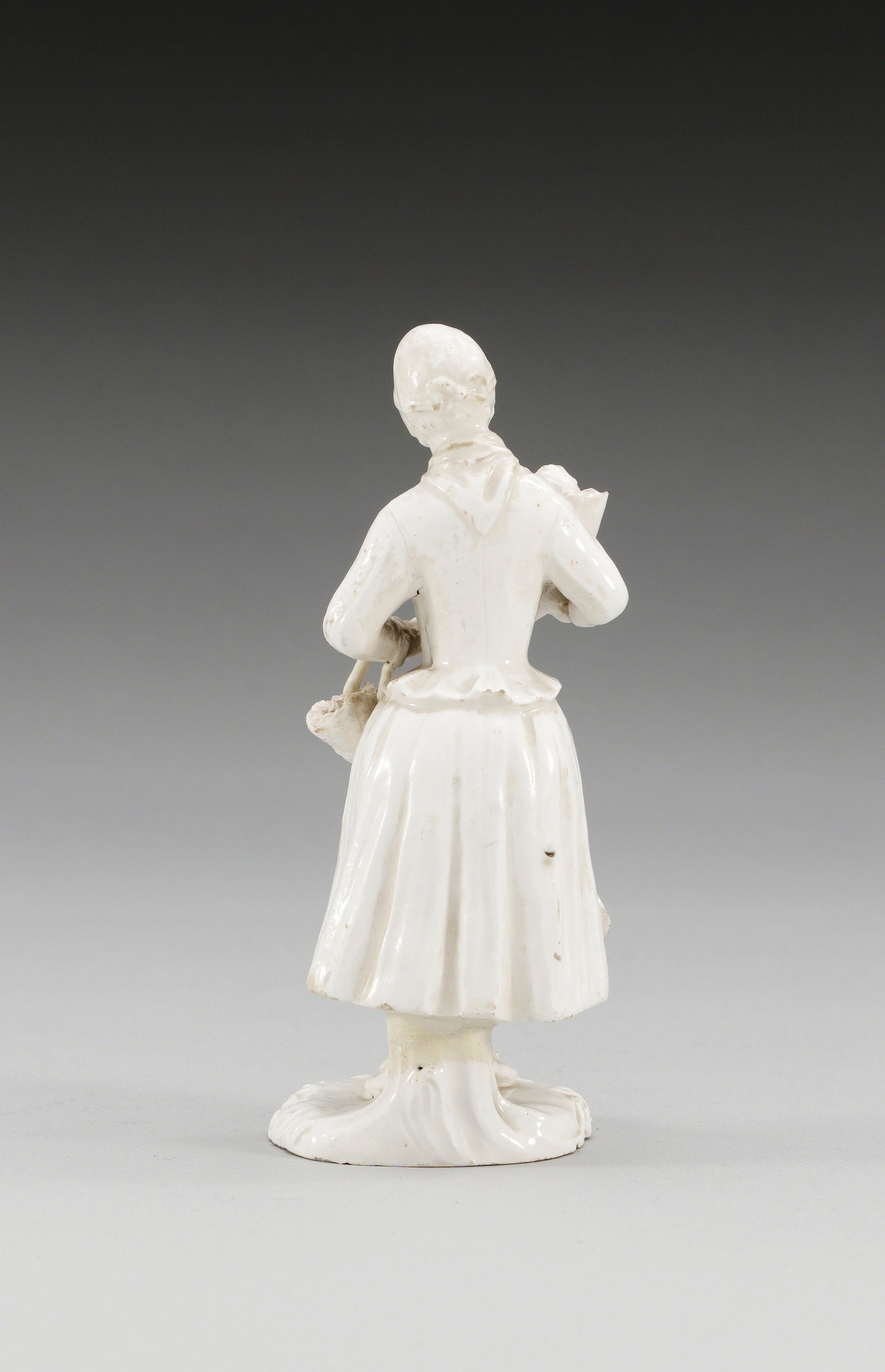 A Swedish white glazed Marieberg soft paste figure of a mother and ...