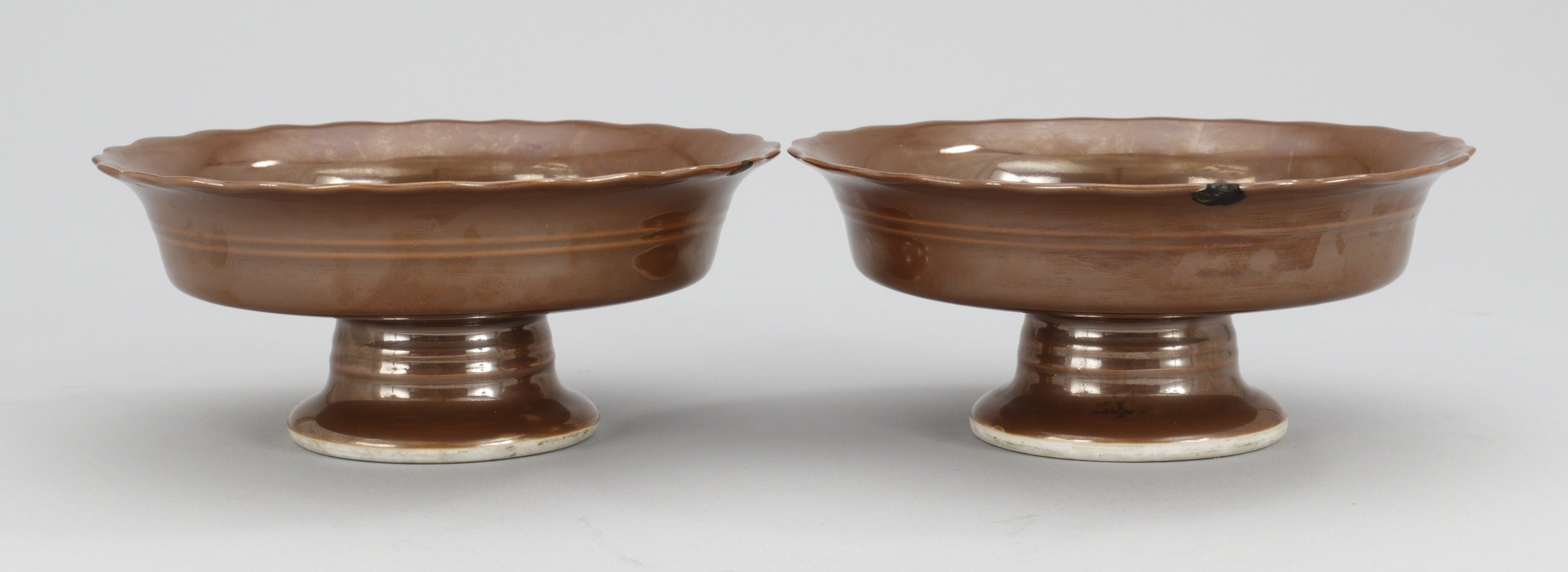 A pair of cappuciner glazed tazzas, China, with Qianlong seal mark ...