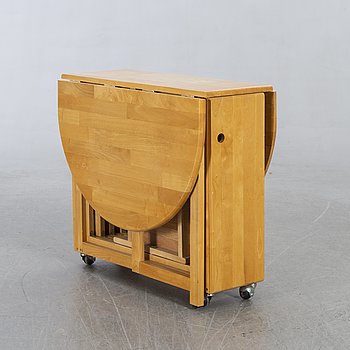 A 1970/80s folding table and four chairs. - Bukowskis