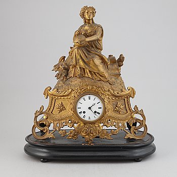 A French rococo revival mantle clock from PH Mourey, ca 1900. - Bukowskis