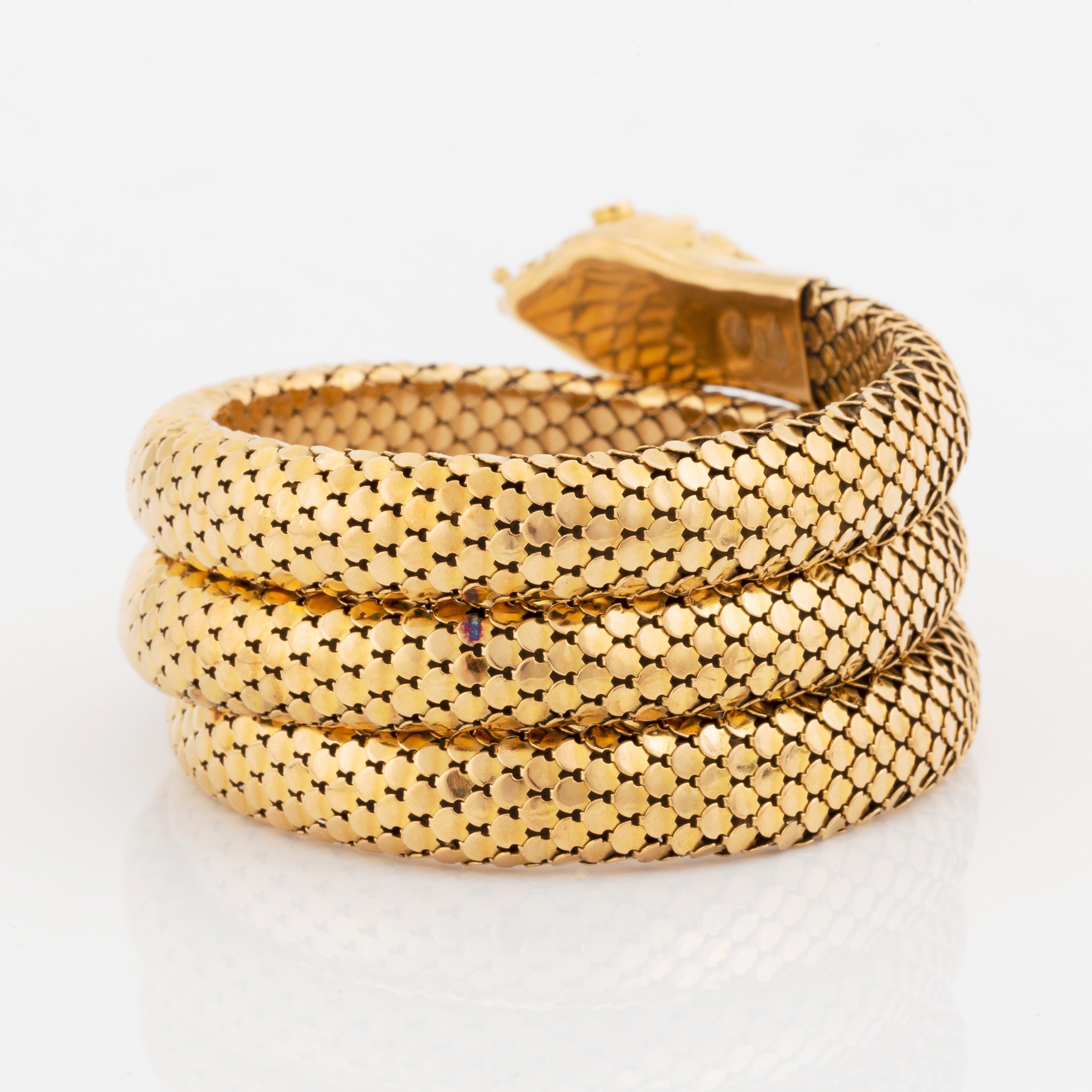 An 18K gold snake bracelet set with rubies. - Bukowskis