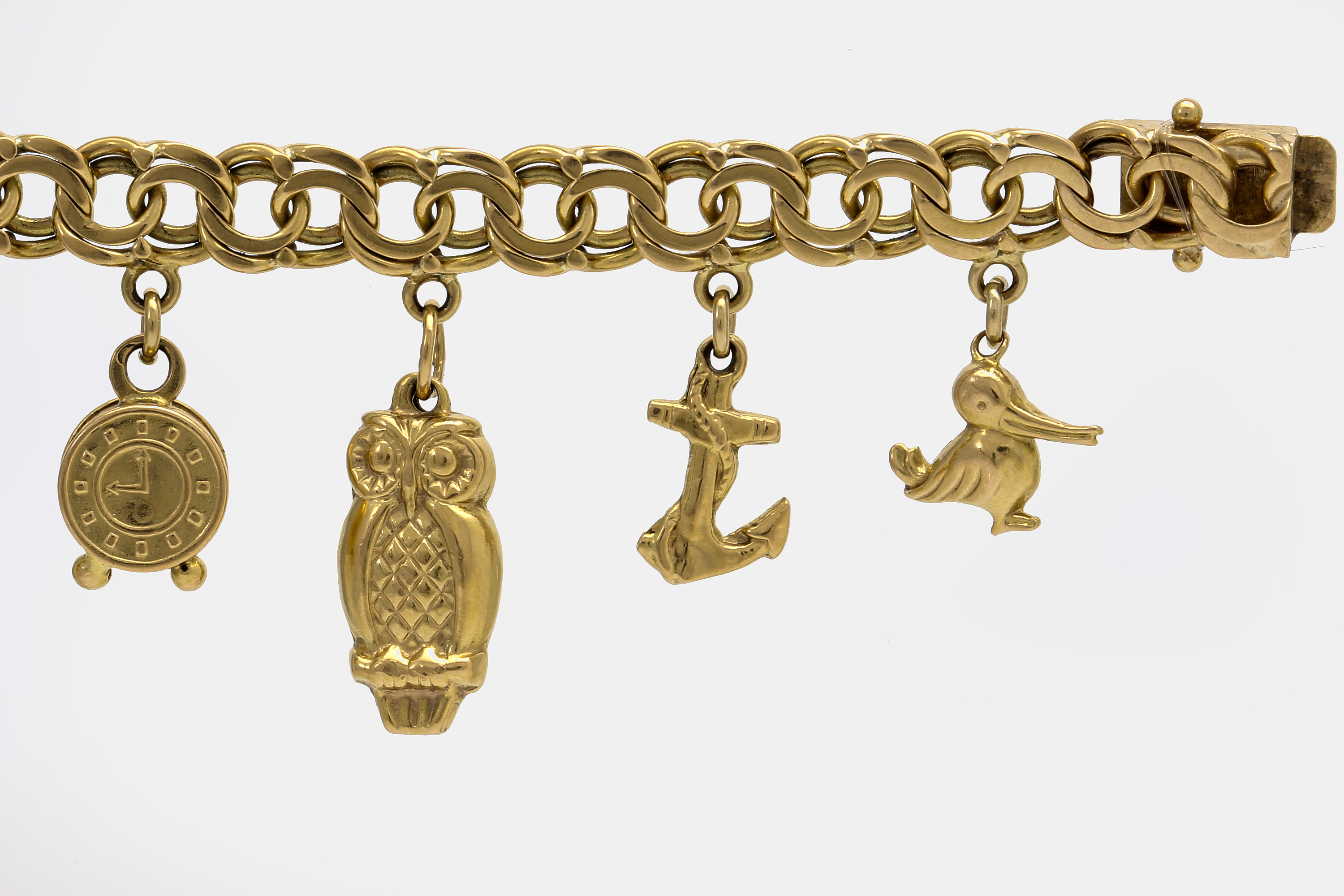Armband 18K guld med berlocker, 29,0 g, ca 19 cm. - Bukowskis