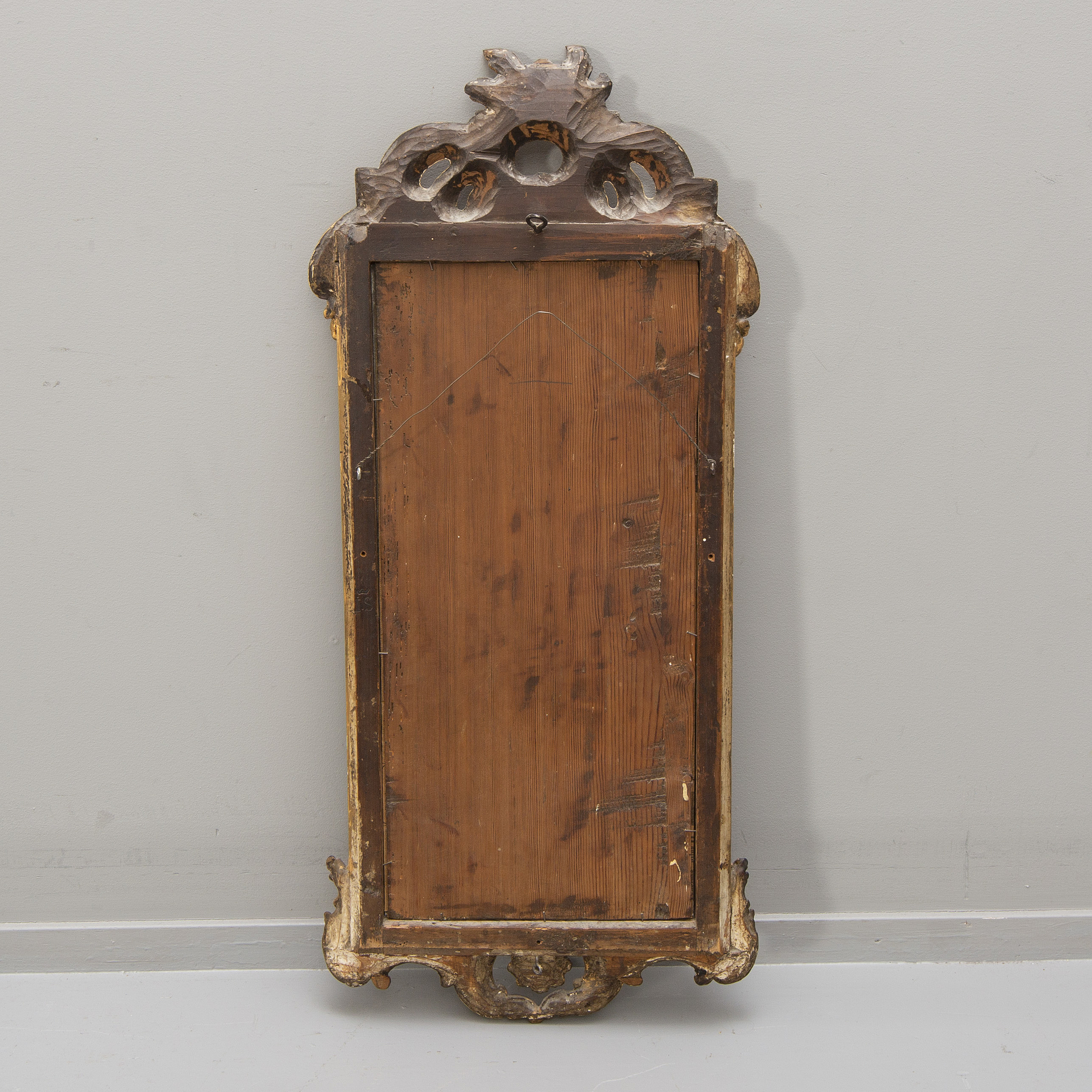 A gilded Swedish Rococo mirror mid 1700s signed Joseph Schürer. - Bukowskis