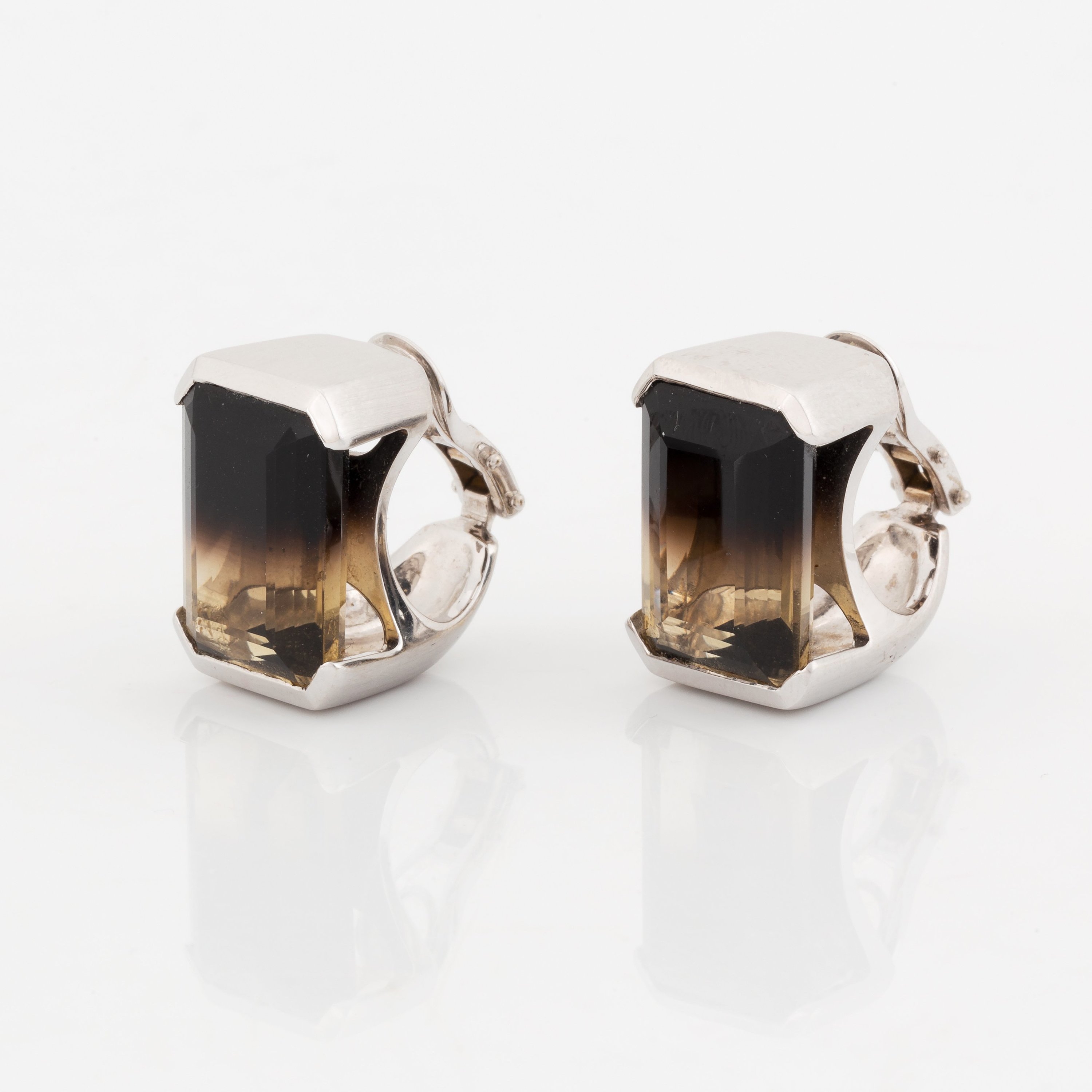 A pair of Tina Karlsson earrings in 18K white gold set with facted ...