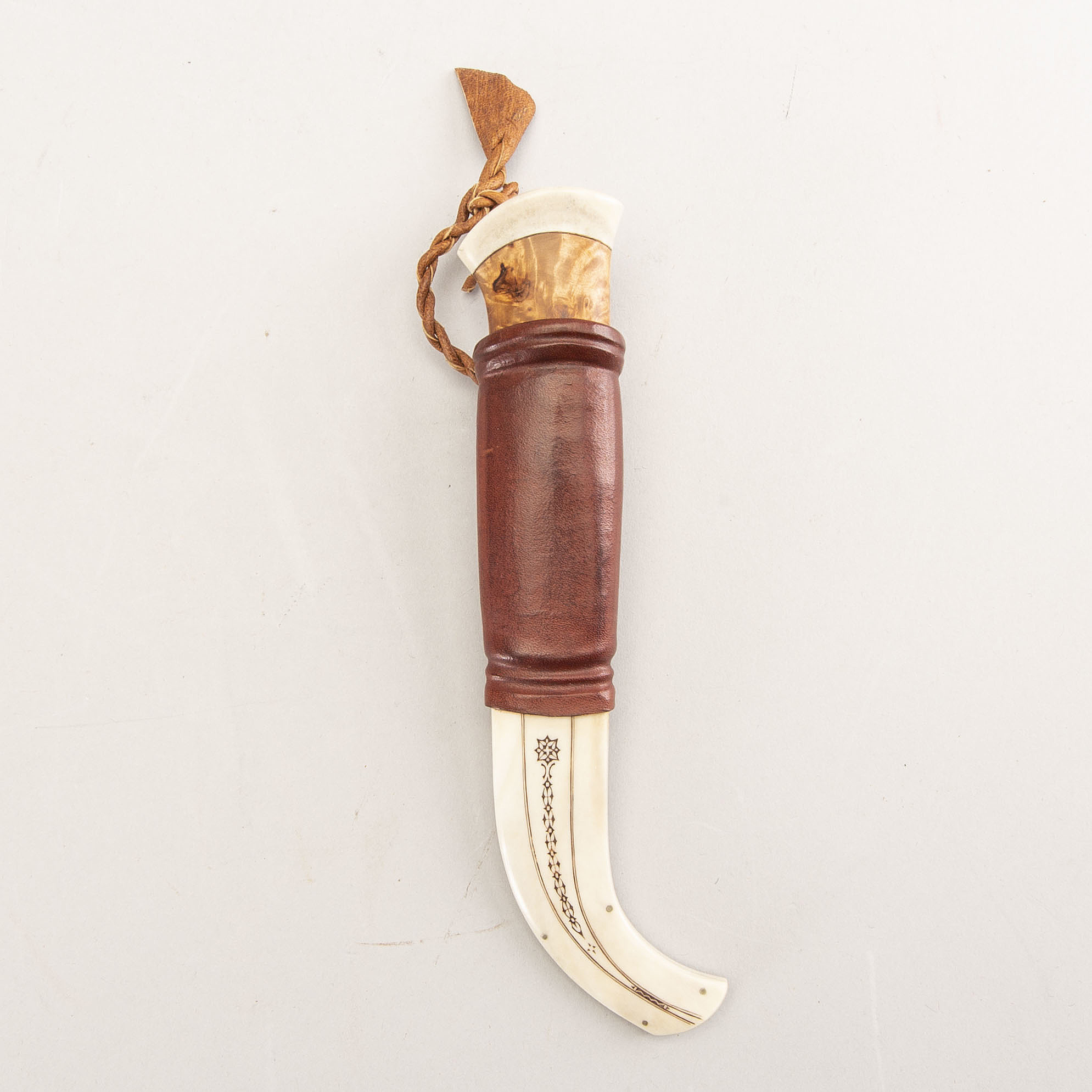 Per Isak Juuso, a signed and dated reindeer horn and leather Sami knife ...