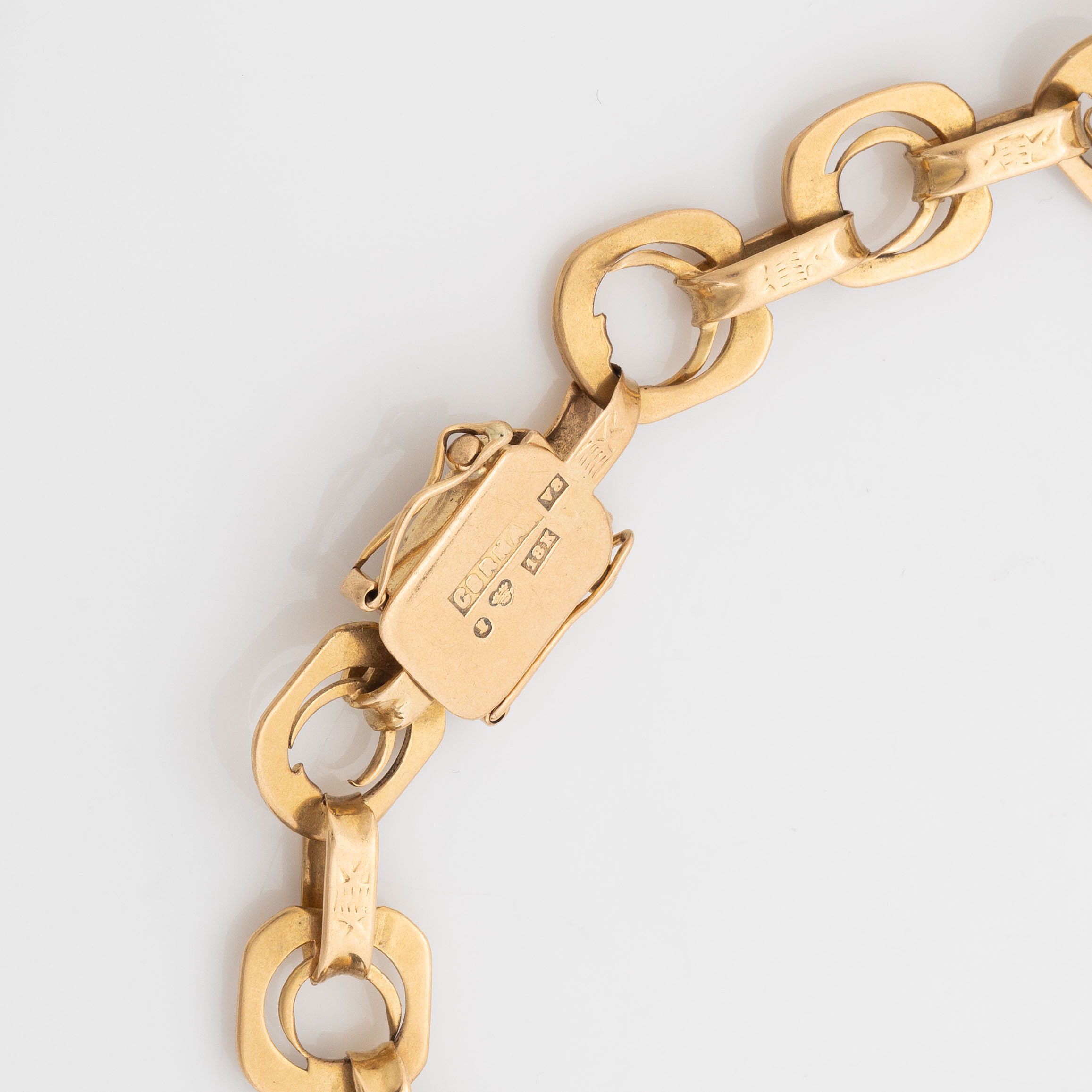 Armband 18K guld med två stenberlocker. - Bukowskis