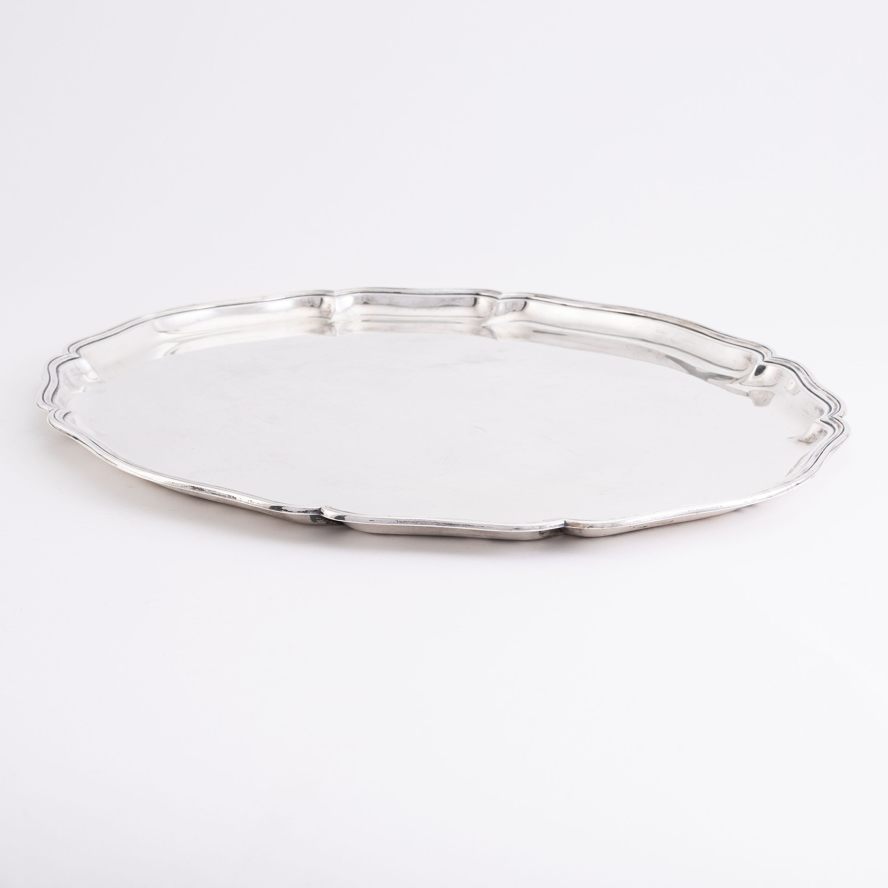 A rococo-style silver charger, 20th century. - Bukowskis