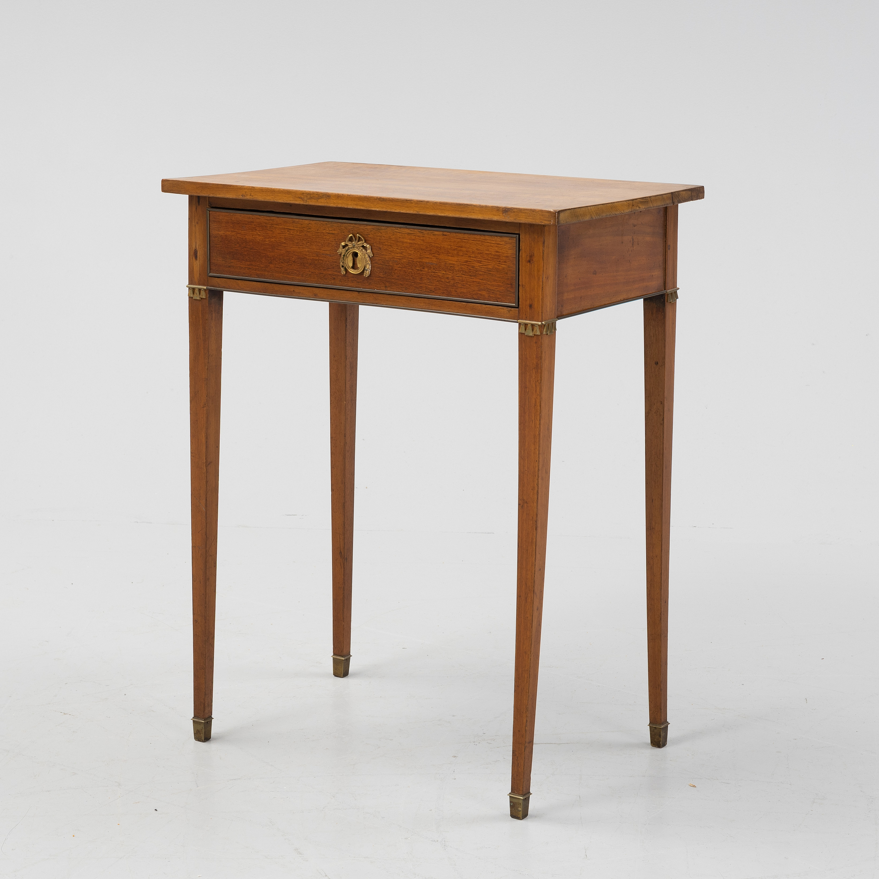 A late Gustavian mahogany veneered sewing-table, circa 1800. - Bukowskis