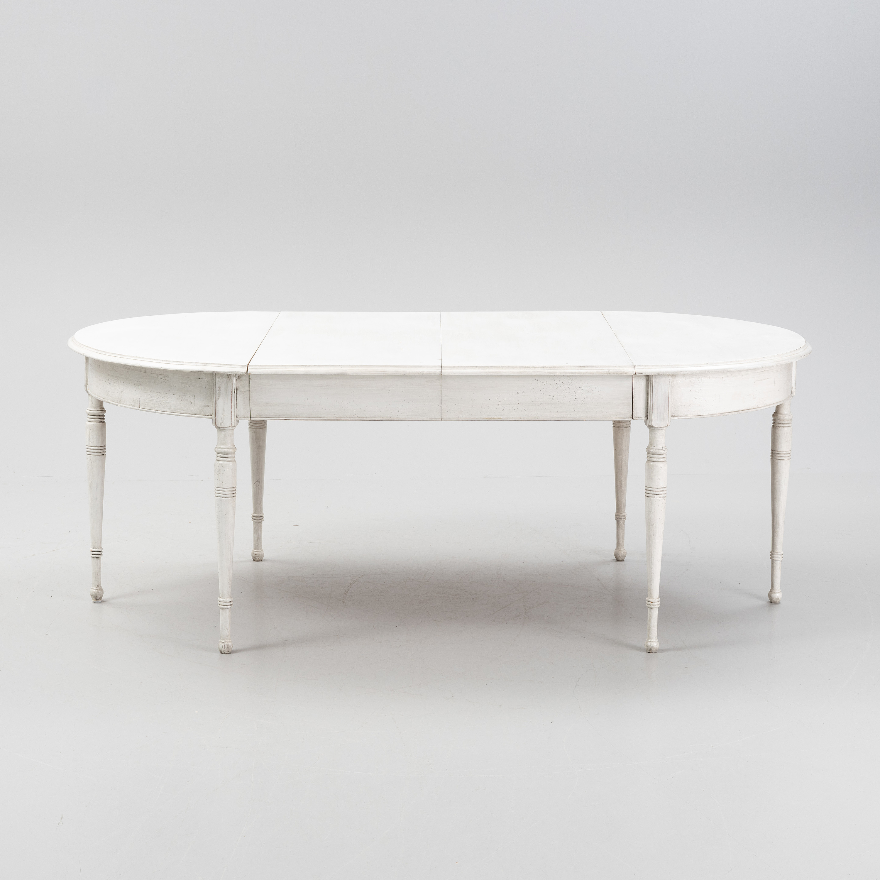 A painted dining table, circa 1900. - Bukowskis