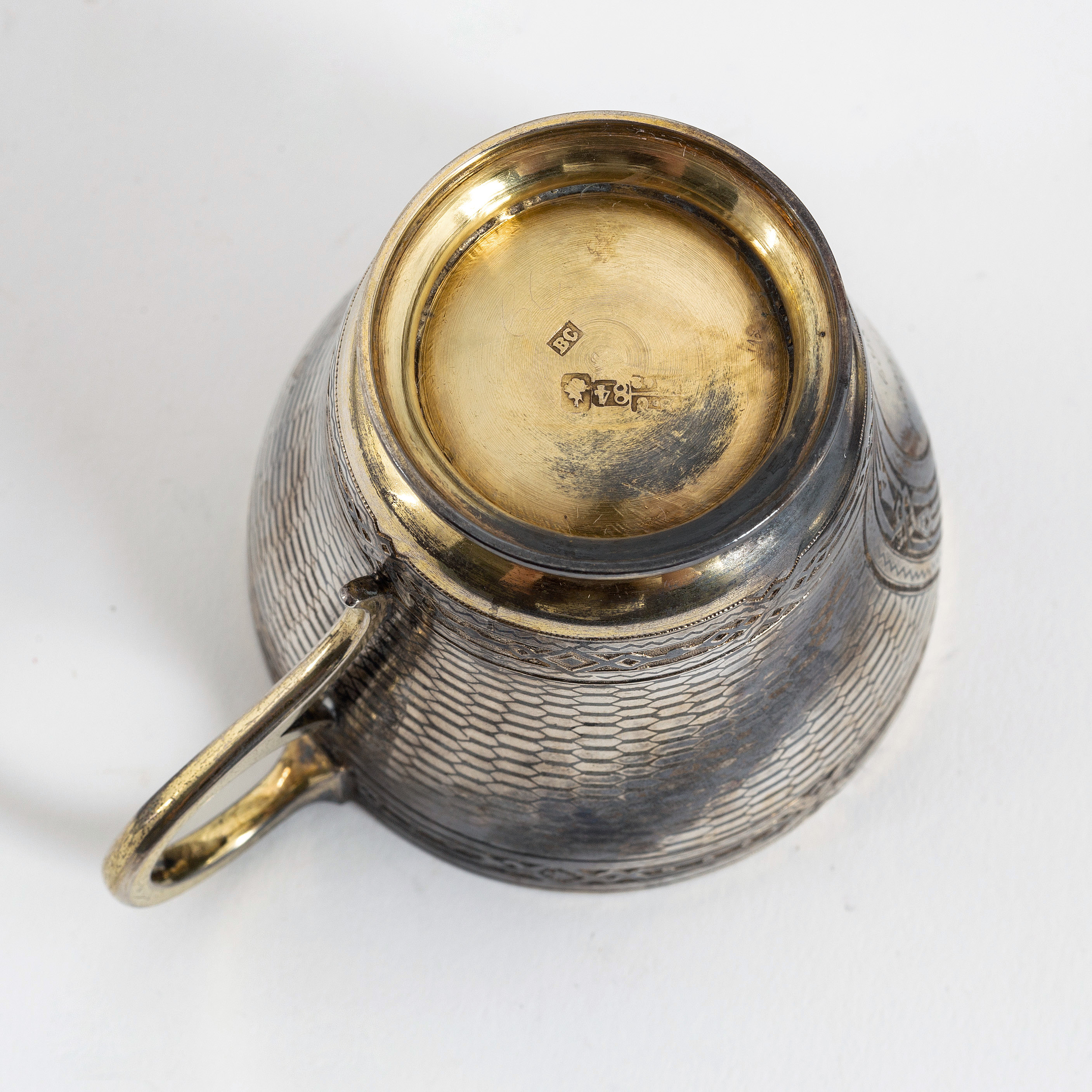 A silver-gilt teacup and saucer, mark of Vasily Semenov, Moscow 1862 ...