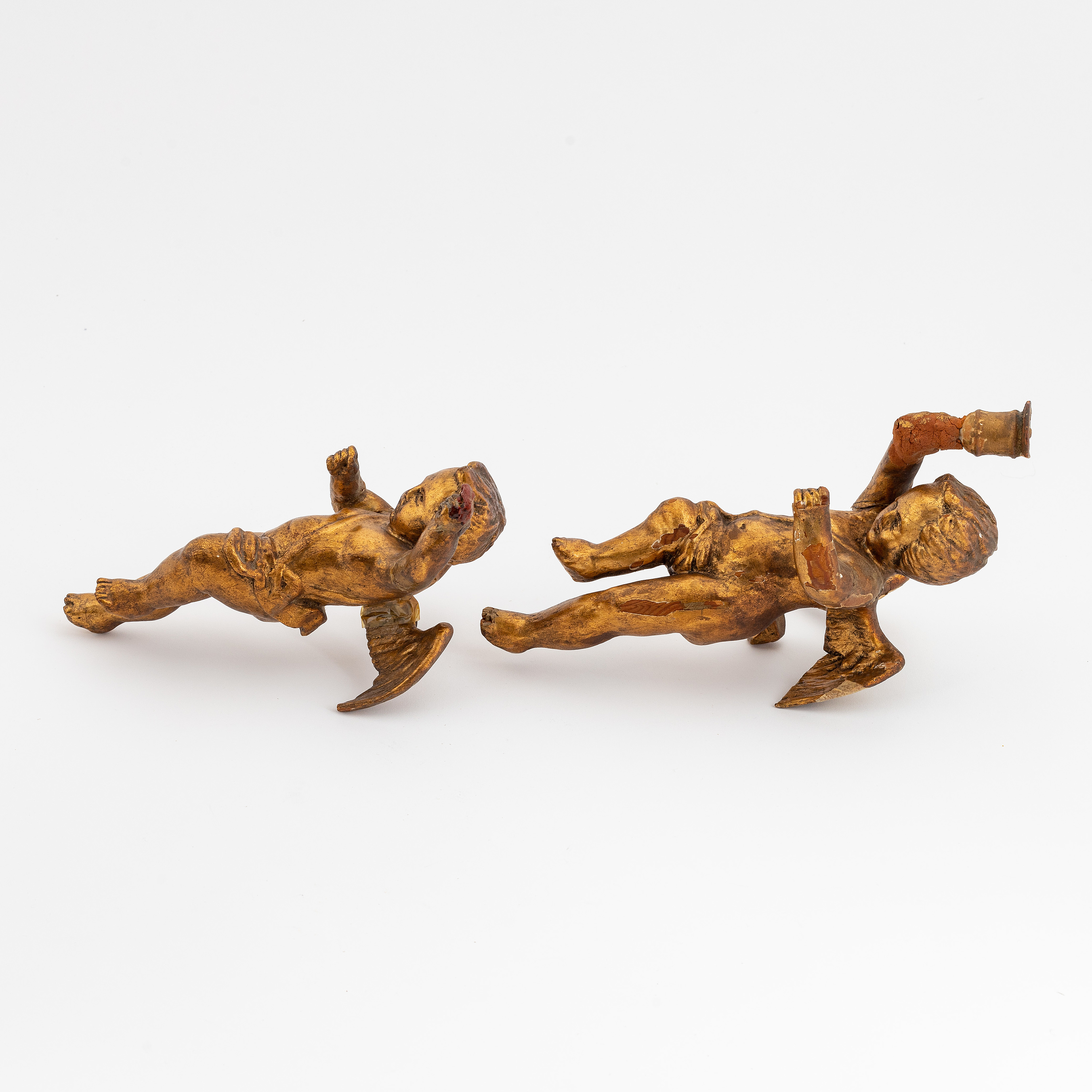 A pair of baroque wooden cupid sculptures, 18th century. - Bukowskis