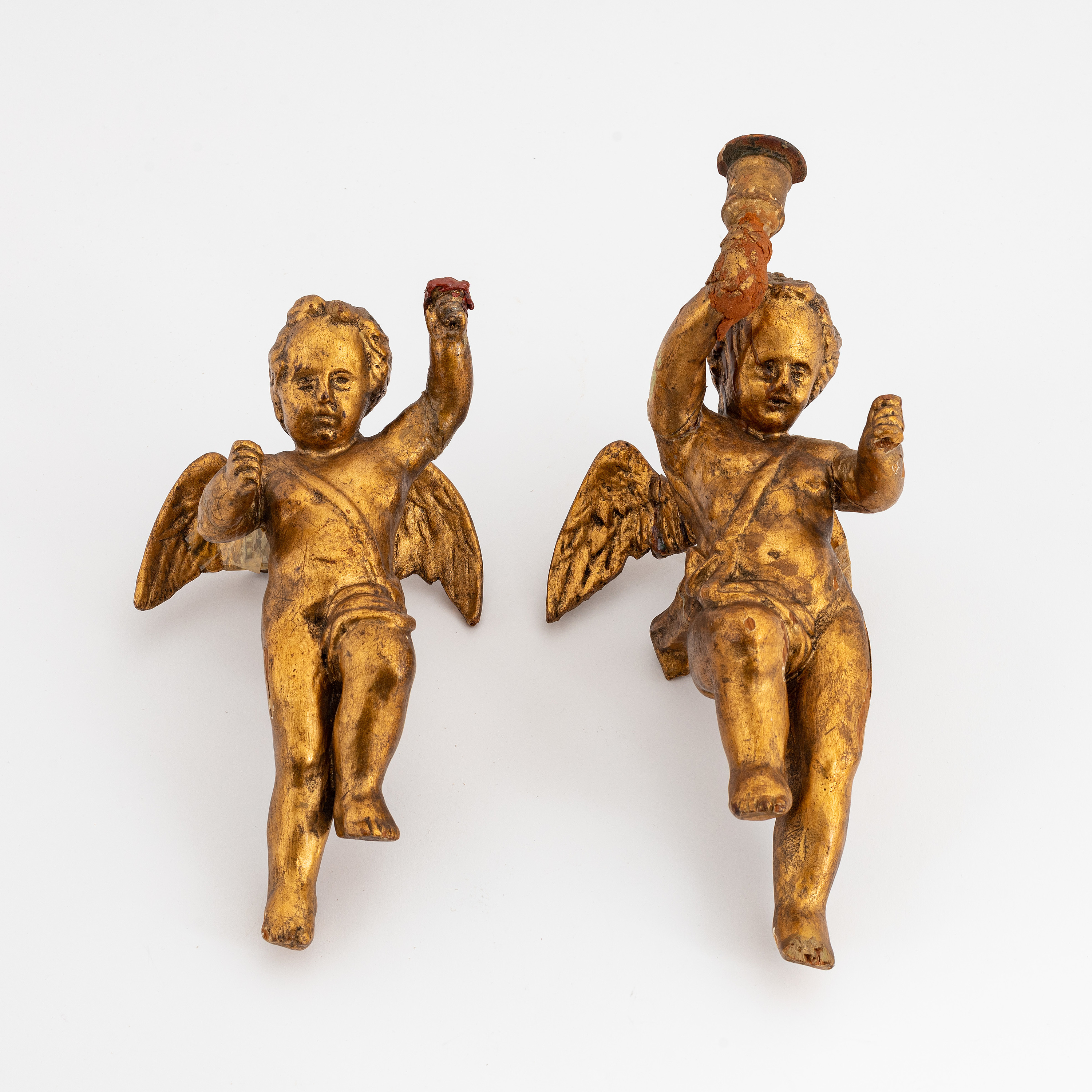 A pair of baroque wooden cupid sculptures, 18th century. - Bukowskis