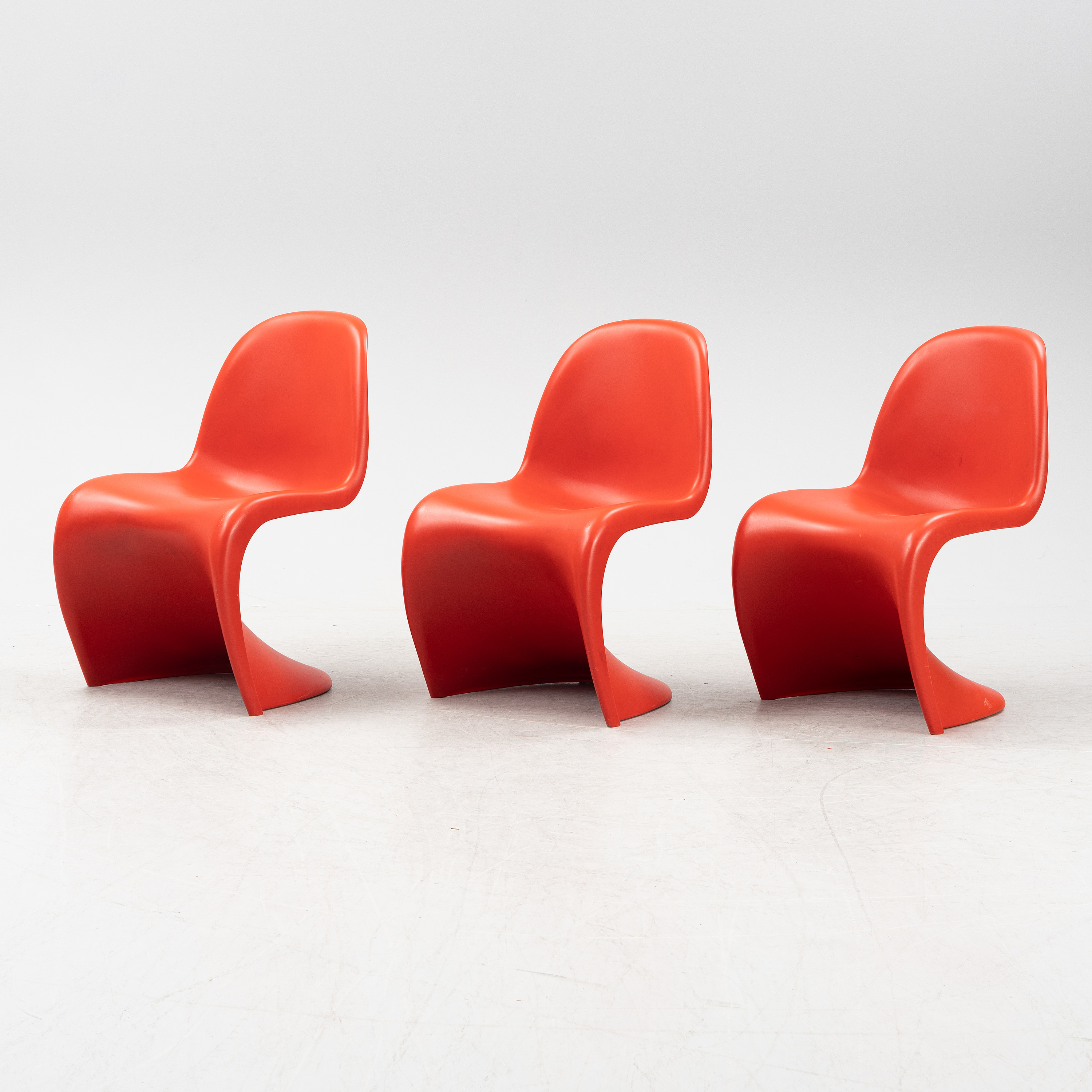 Verner Panton, thee red plastic 'Panton Chair Classic' chairs, Vitra ...