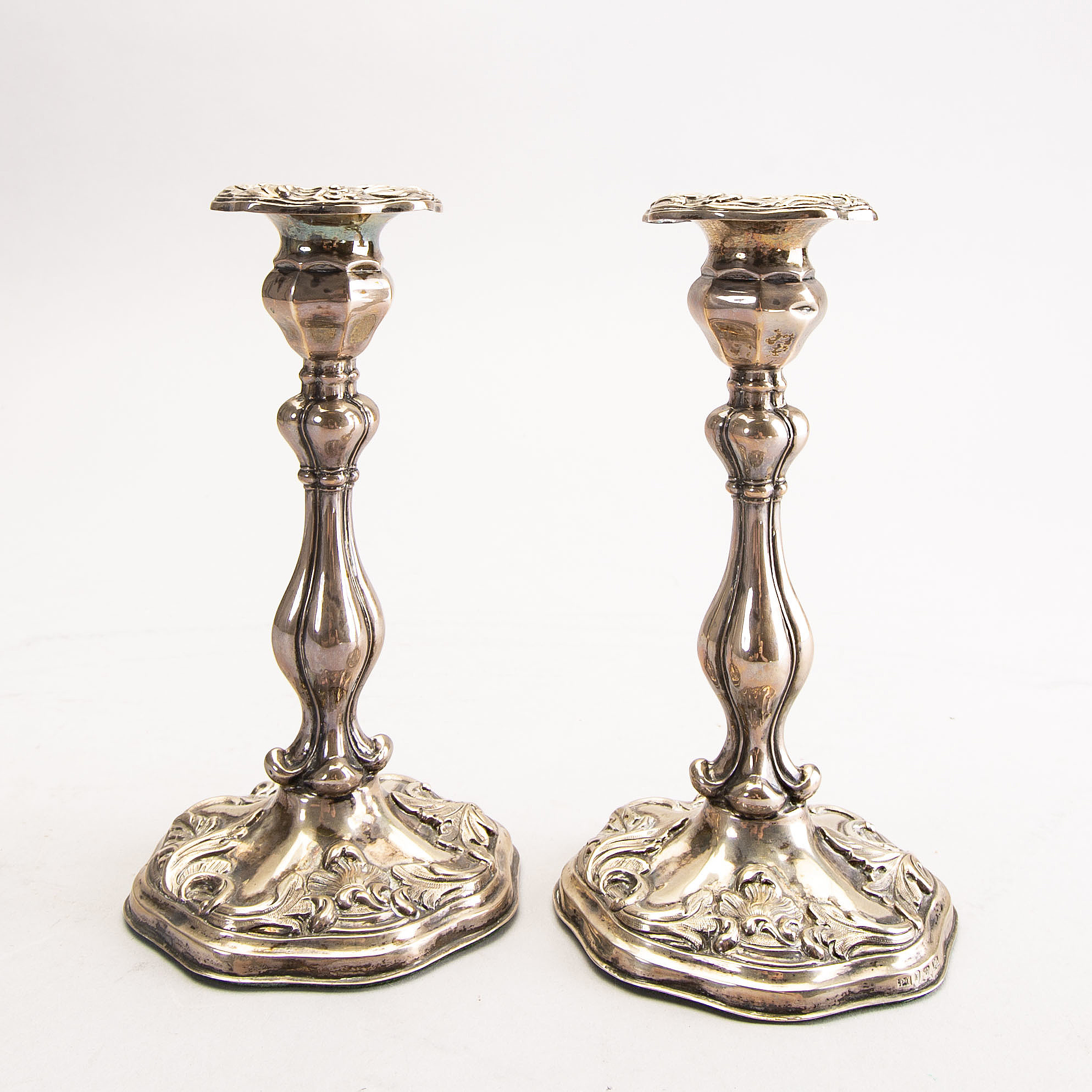 A pair of Swedish 19th century silver neo Rococo candle sticks mark of ...