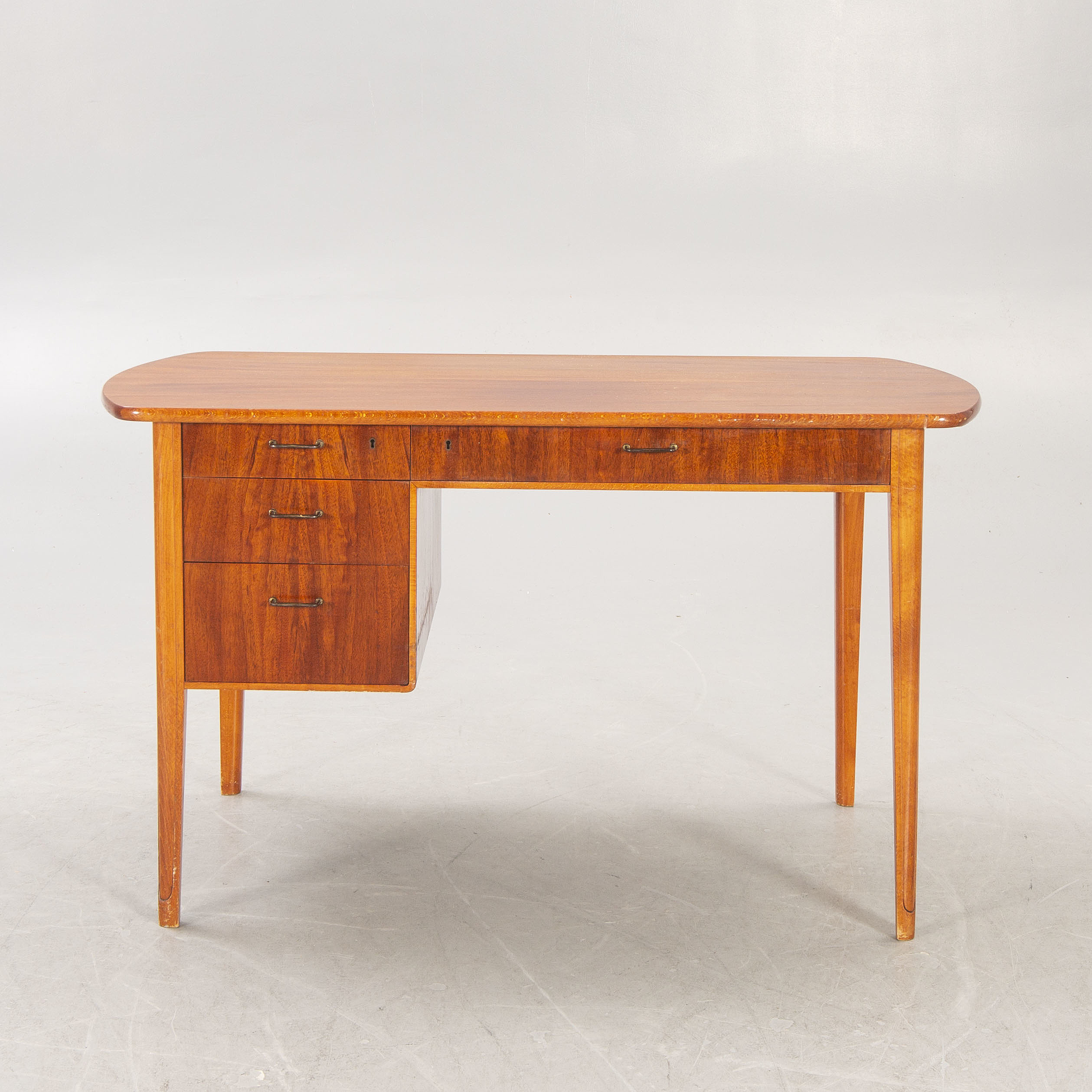 A 1950s teak desk. - Bukowskis