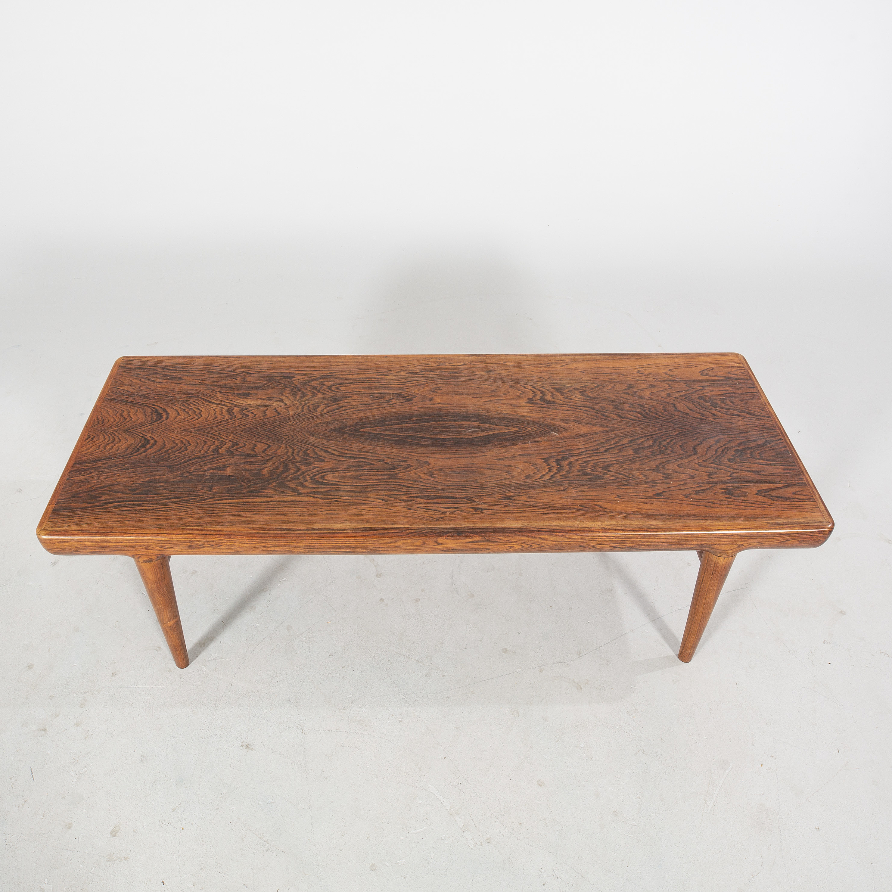 A 1960's jacaranda coffee table by Johannes Andersen, Denmark. - Bukowskis