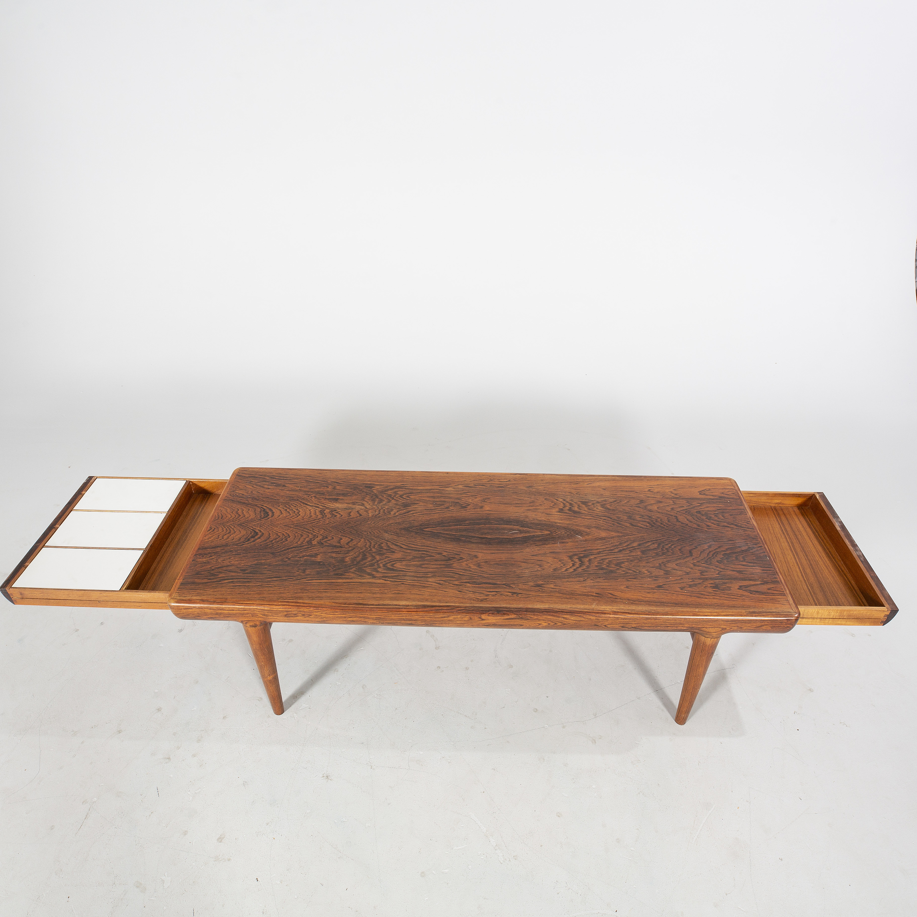 A 1960's jacaranda coffee table by Johannes Andersen, Denmark. - Bukowskis