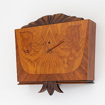 A wall clock, Mjölby Intarsia, 1930's. - Bukowskis