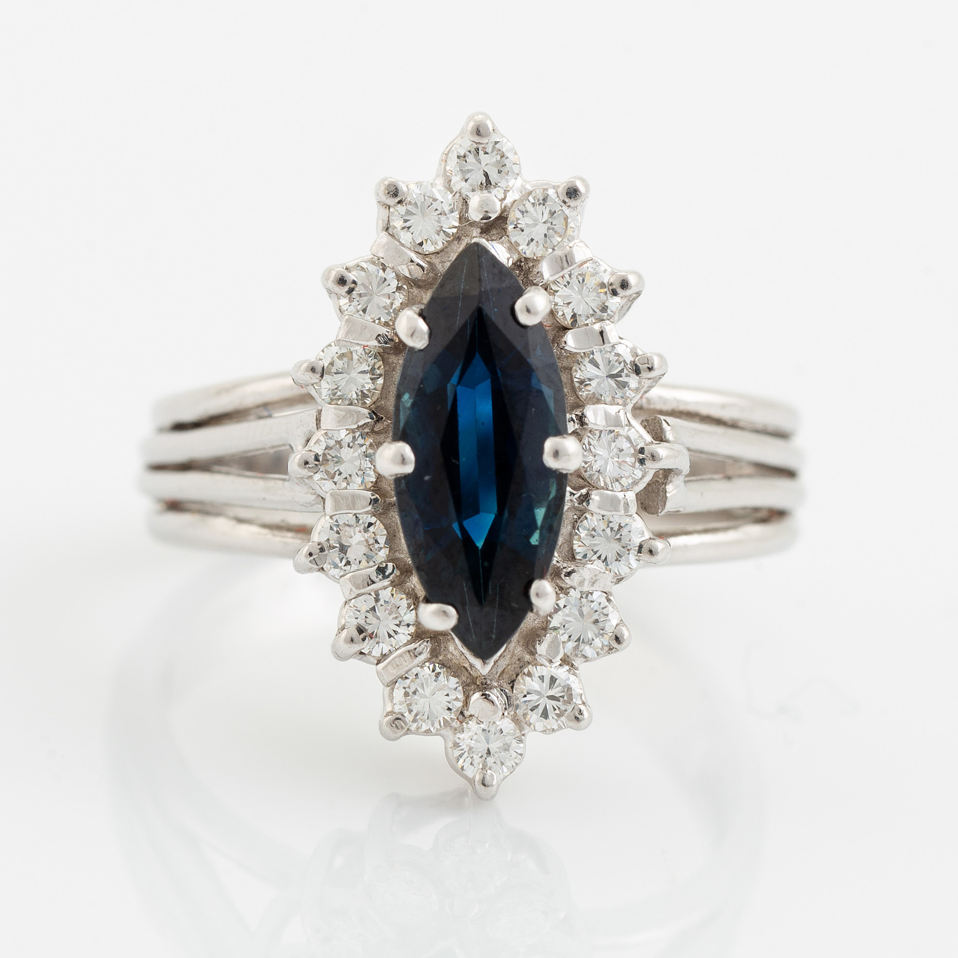 Navette cut sapphire and brilliant cut diamond ring. - Bukowskis