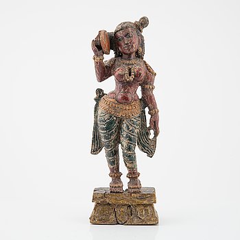 A wooden sculpture of a deity, Indian, 20th Century. - Bukowskis